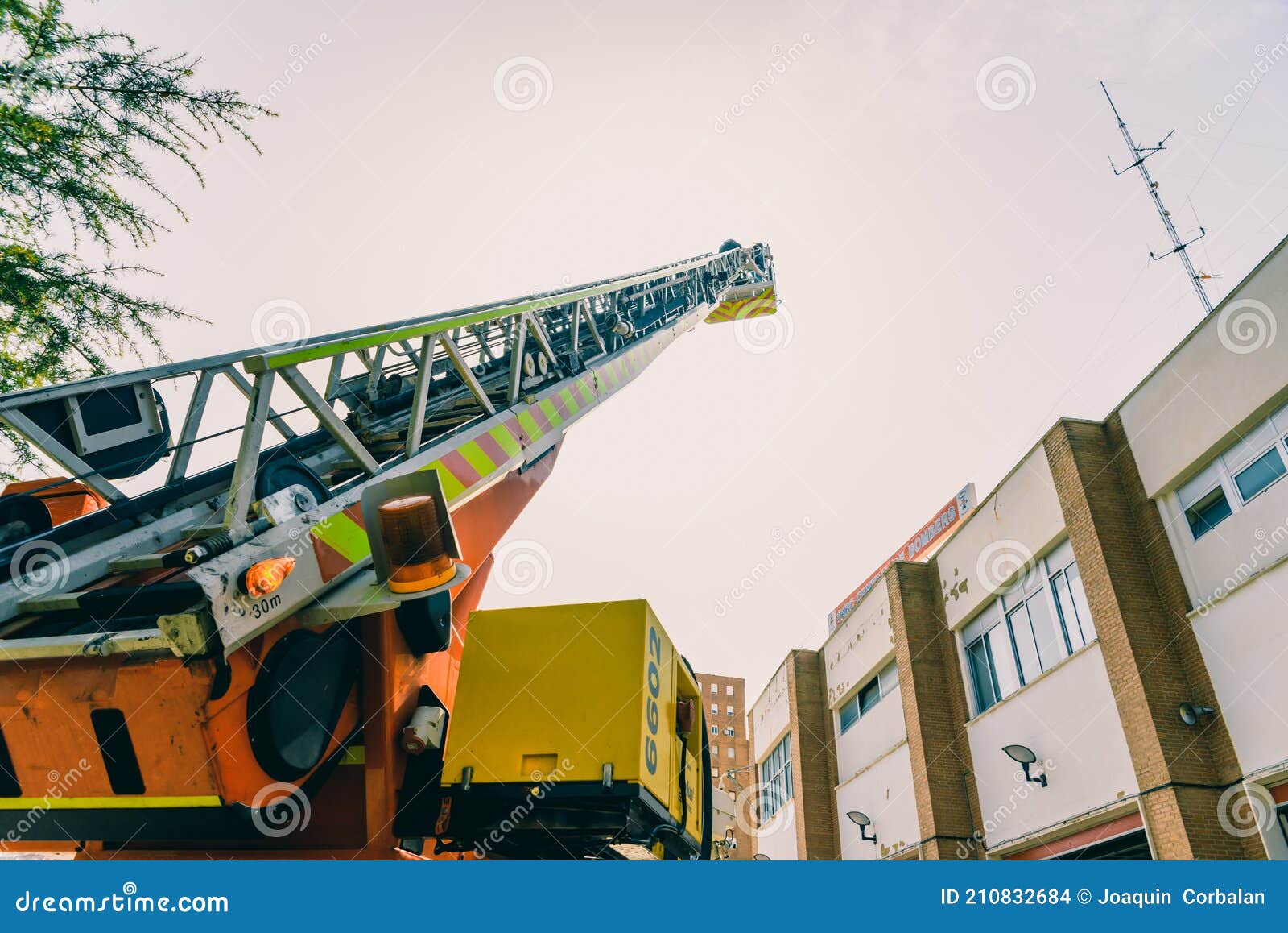 Mechanical Scale of Firefighters Seen from Below with Blue Sky in the ...