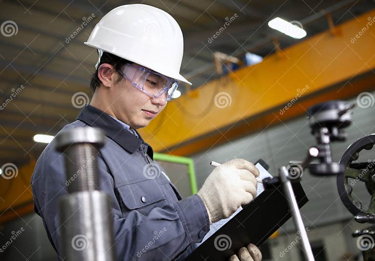 Mechanical Technician Writing on Notepad Stock Image - Image of person ...