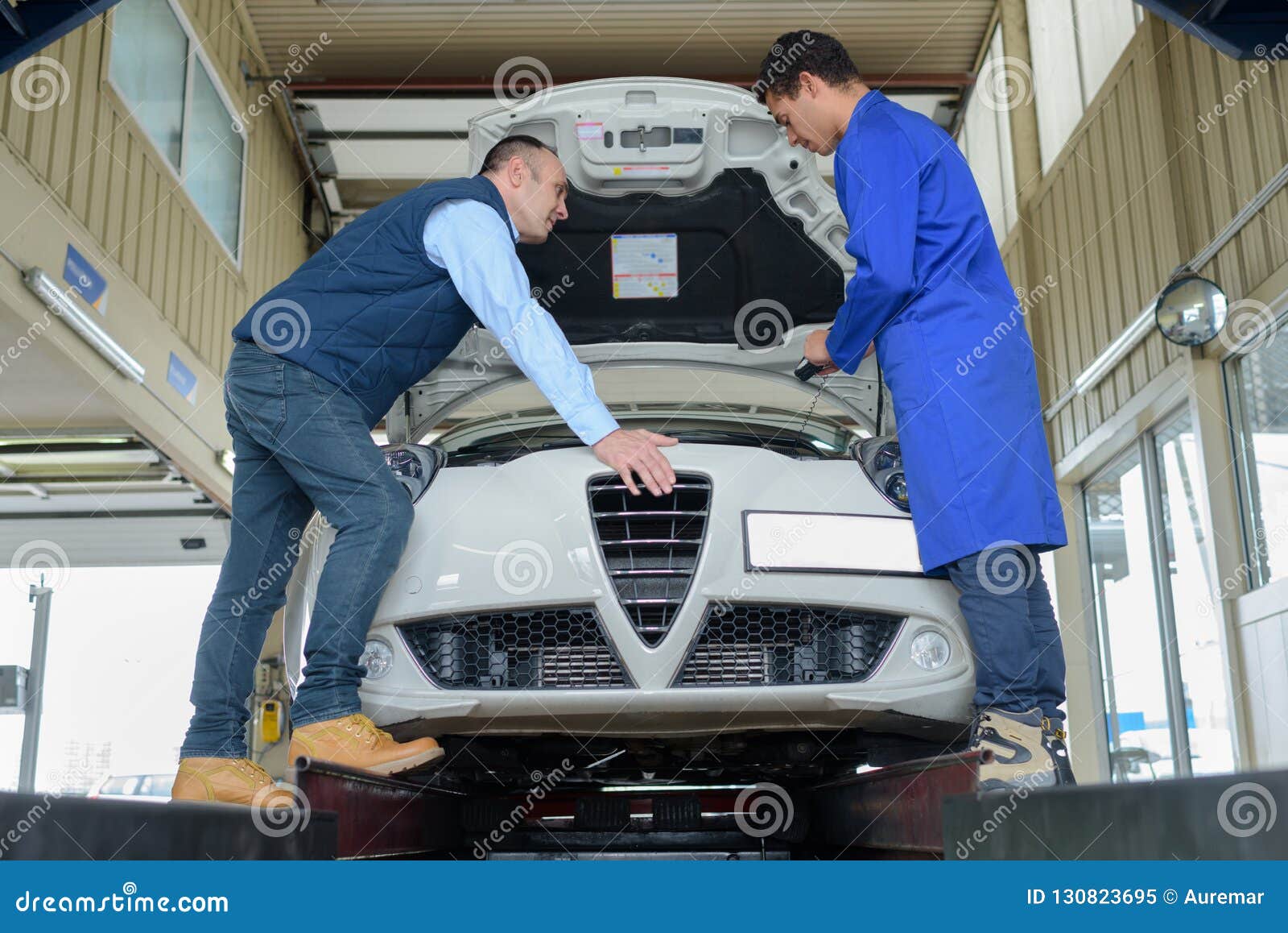 Mechanics Checking Car Engine Stock Image - Image of young, business ...