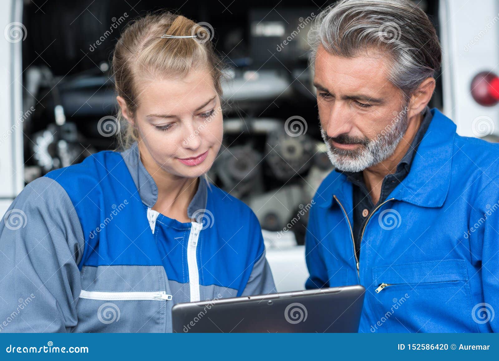 Mechanics Checking Information from Tablet Stock Photo - Image of ...