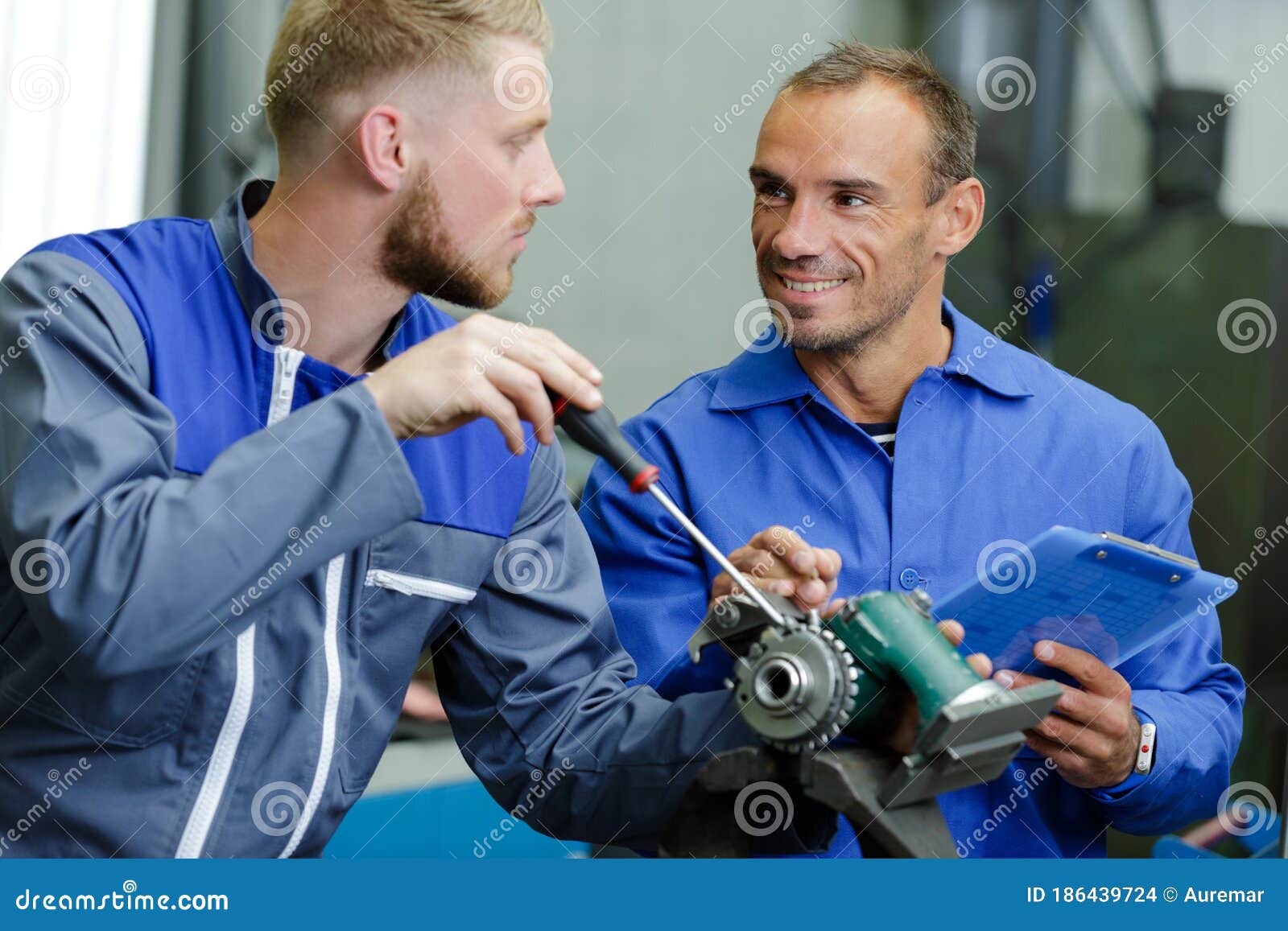 Mechanics Fixing Pice on Machine Stock Photo - Image of company ...