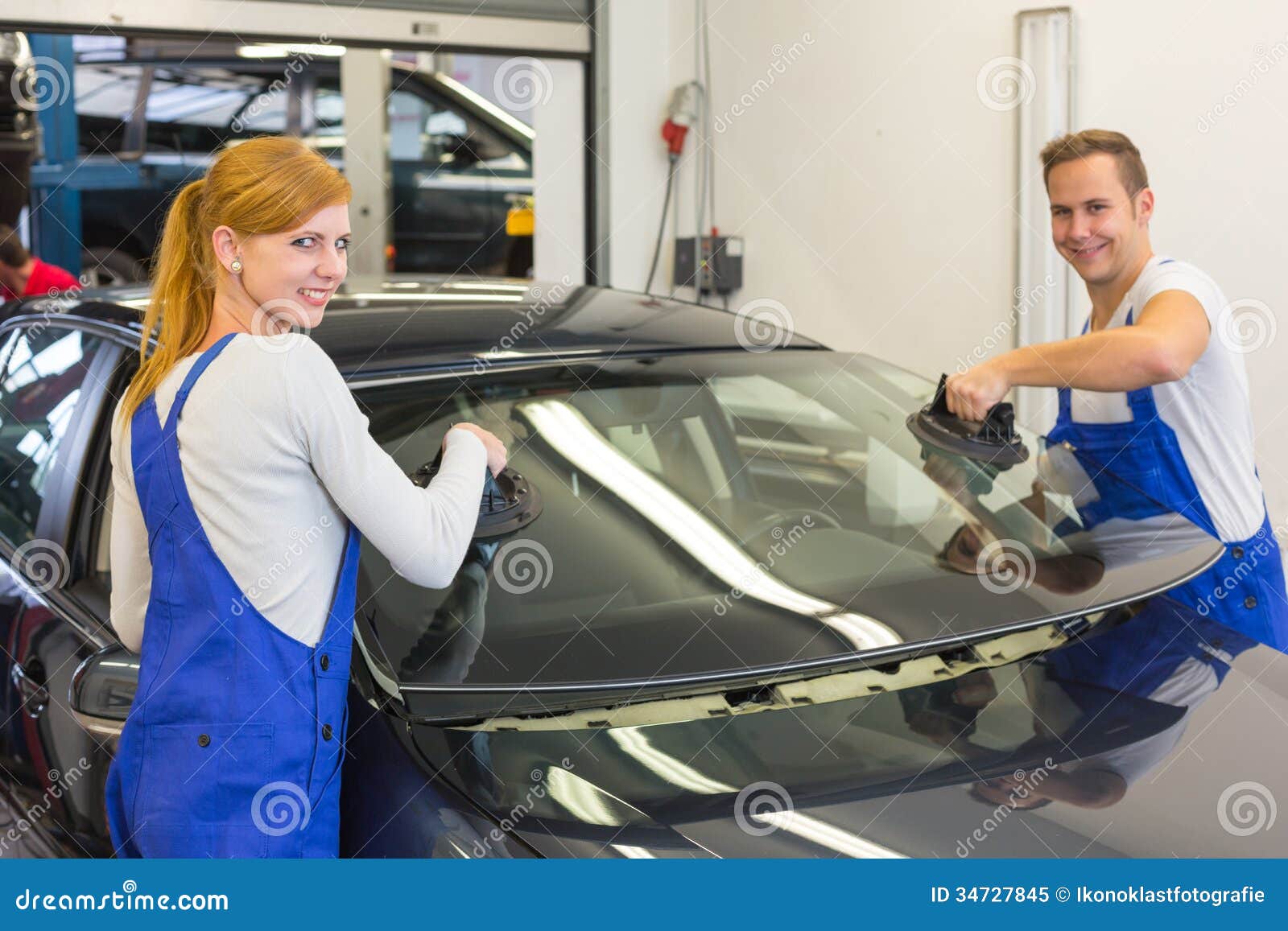 Mechanics or Glaziers Install Windshield or Windscreen on Car Stock ...