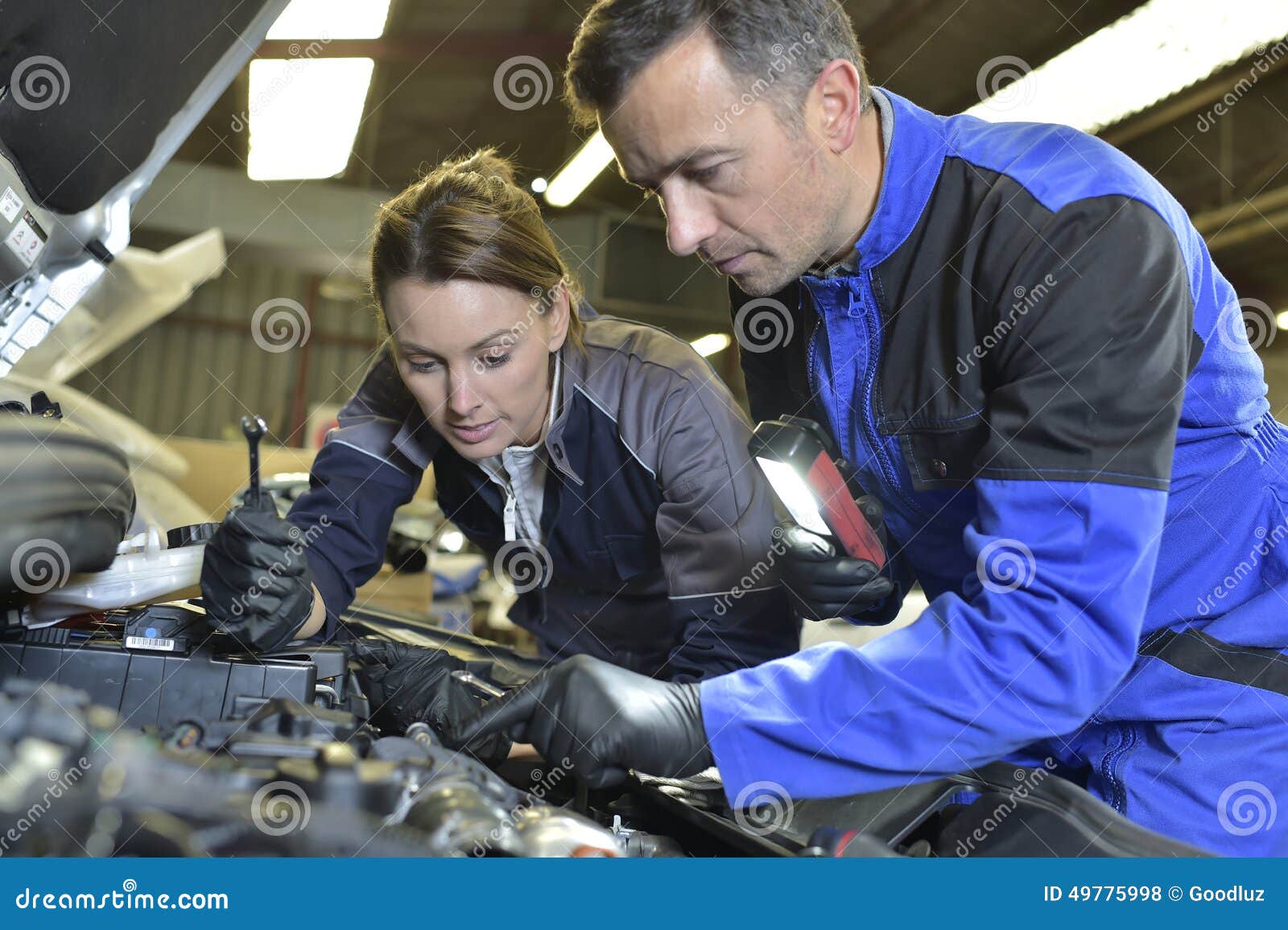 Mechanics Instructor Teaching Apprentice Stock Photo - Image of girl ...