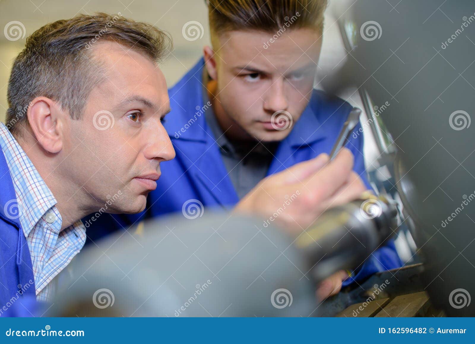 Mechanics solving problem stock photo. Image of middle - 162596482