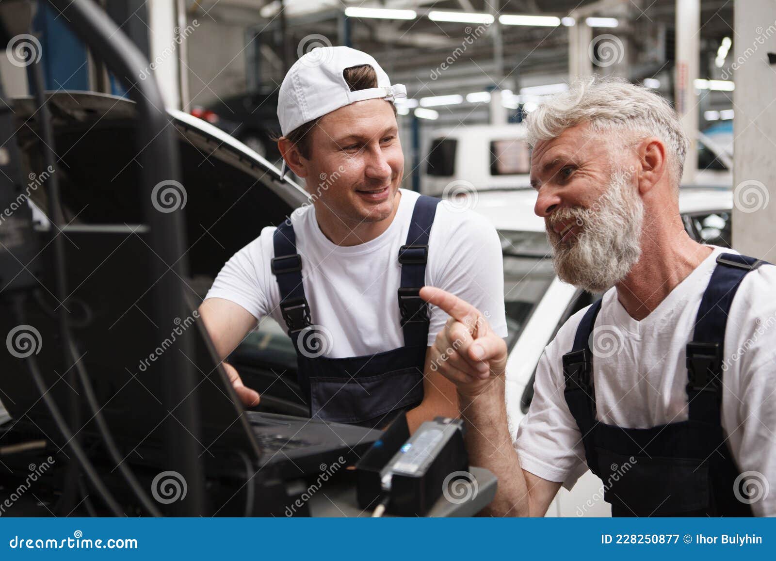 Mechanics Team Working at Car Service Station Stock Image - Image of ...
