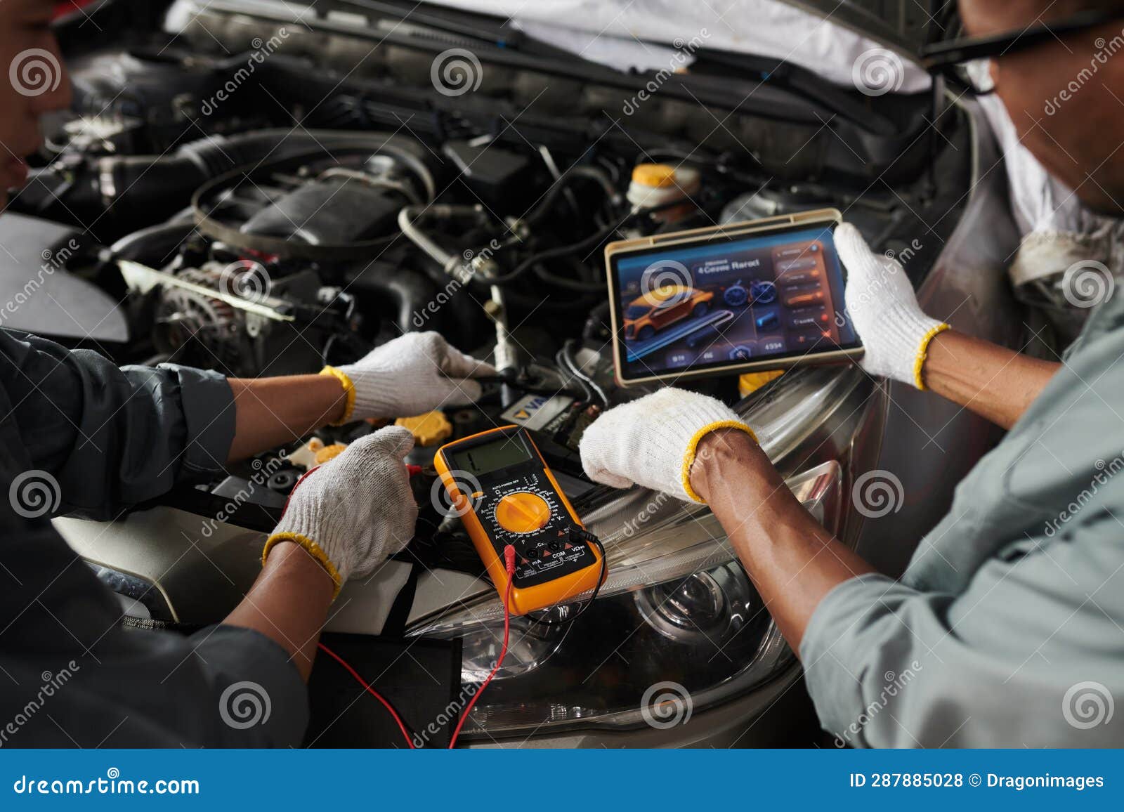 Mechanics Using Application on Tablet Stock Photo - Image of mechanic ...