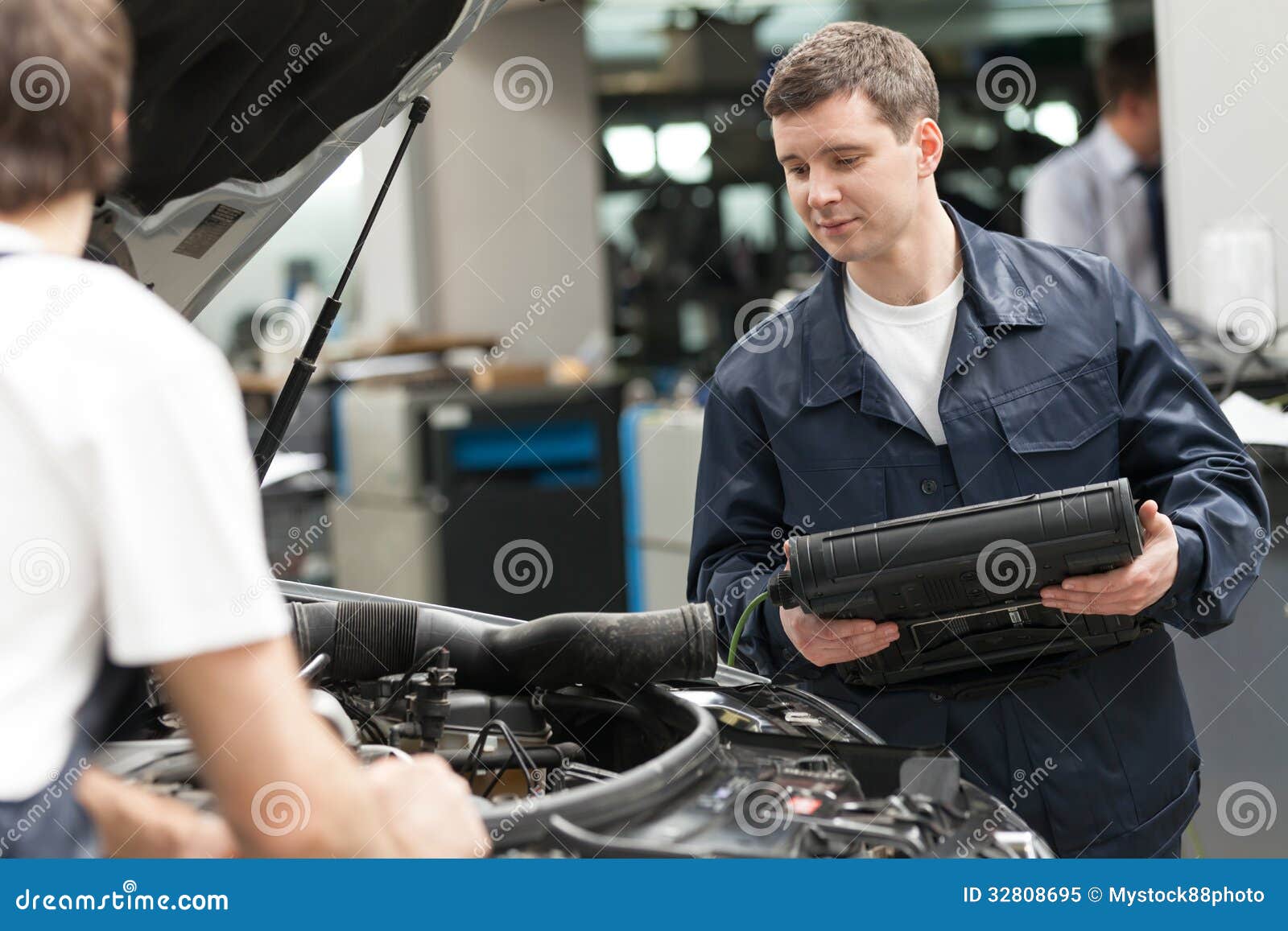 Mechanics at work shop. T stock image. Image of repairing - 32808695
