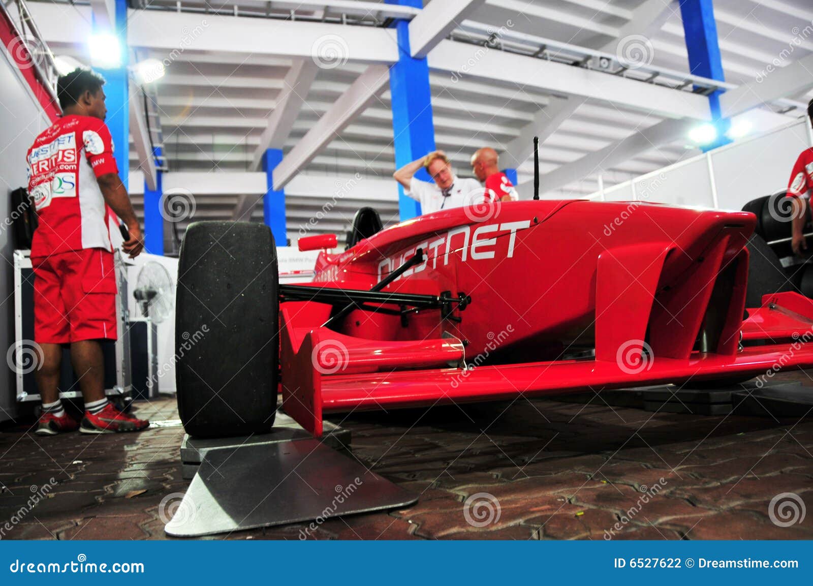 Mechanics Working On A Formula BMW Car - 2 Editorial Photography ...