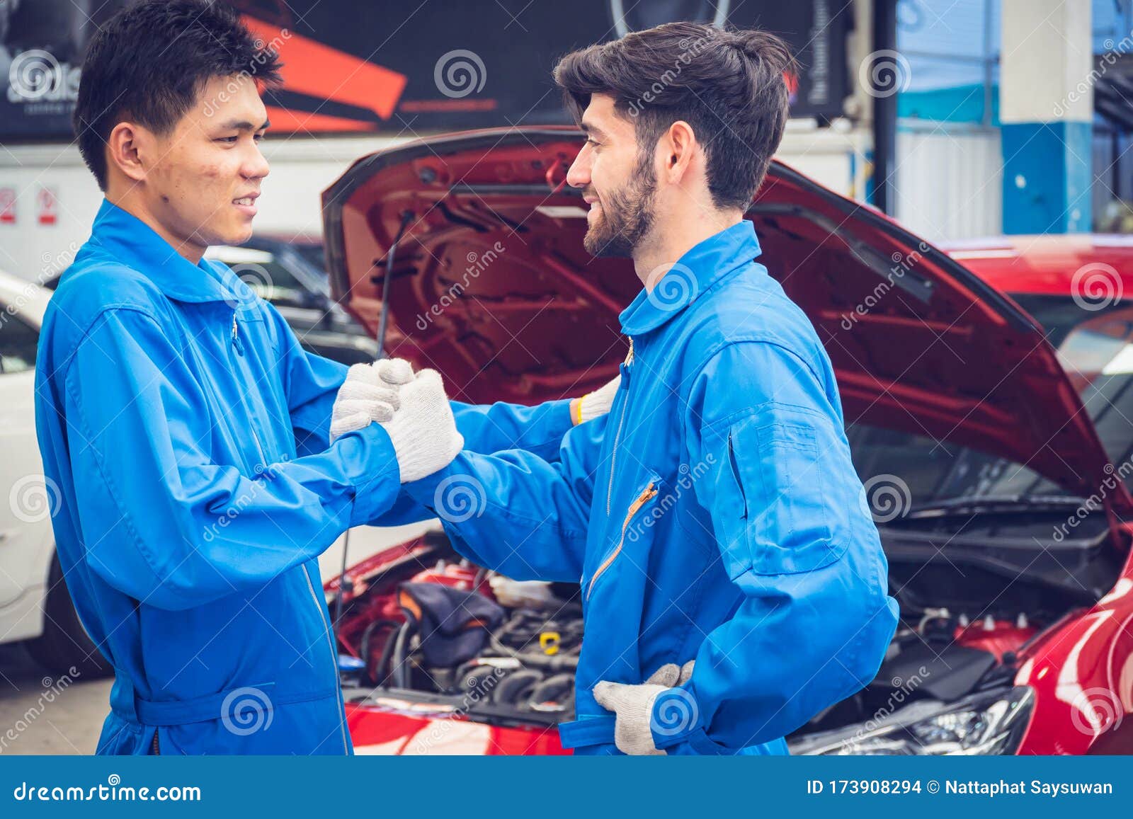 Mechanics Working in the Workshop Garage. Team Work Concepts Stock ...