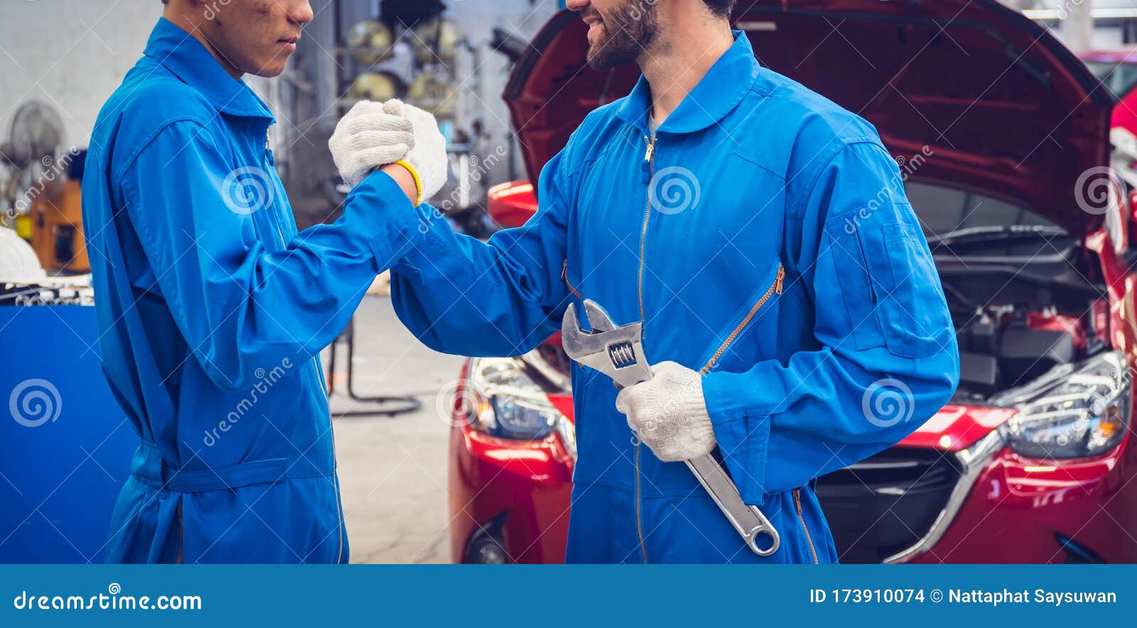 Mechanics Working in the Workshop Garage. Team Work Concepts Stock ...