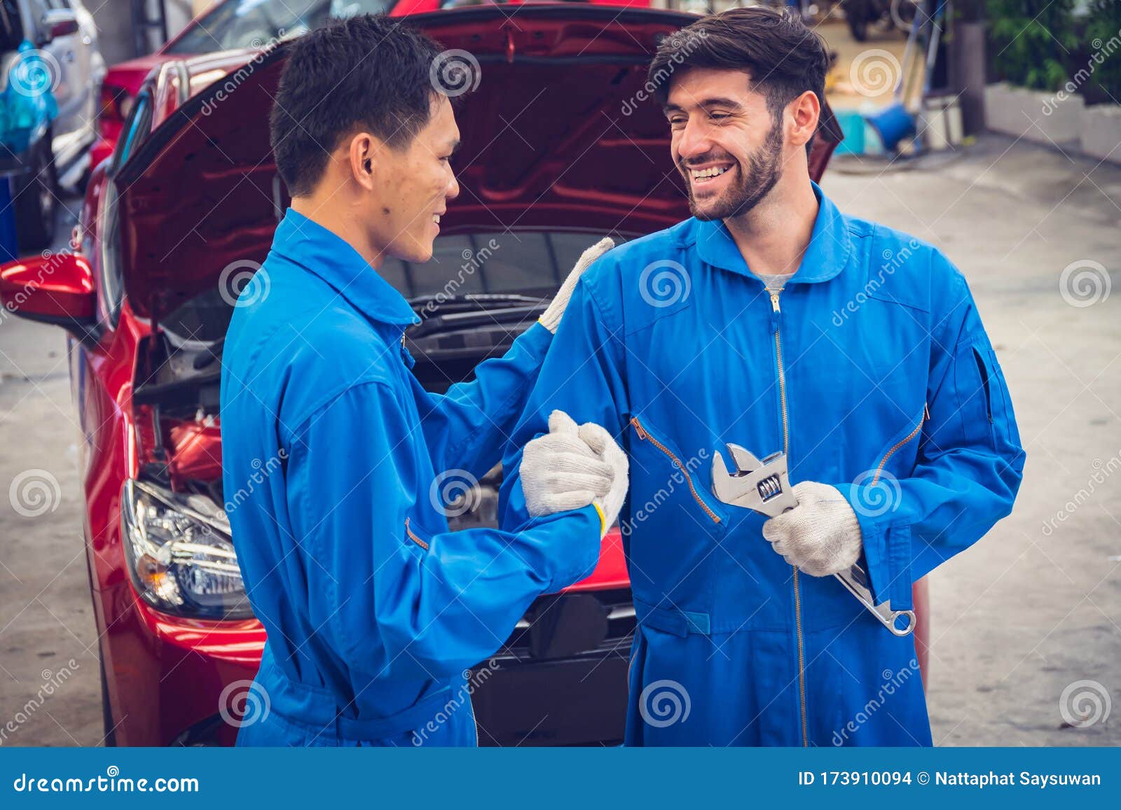 Mechanics Working in the Workshop Garage. Team Work Concepts Stock ...