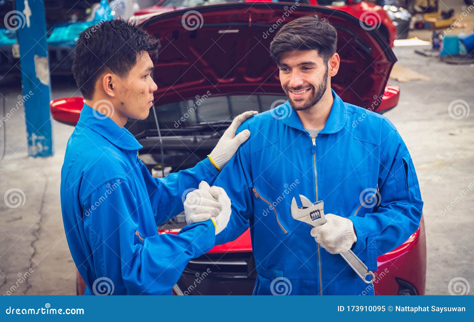 Mechanics Working in the Workshop Garage. Team Work Concepts Stock ...