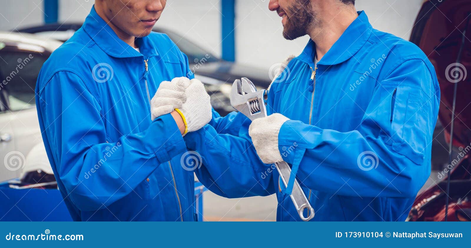 Mechanics Working in the Workshop Garage. Team Work Concepts Stock ...