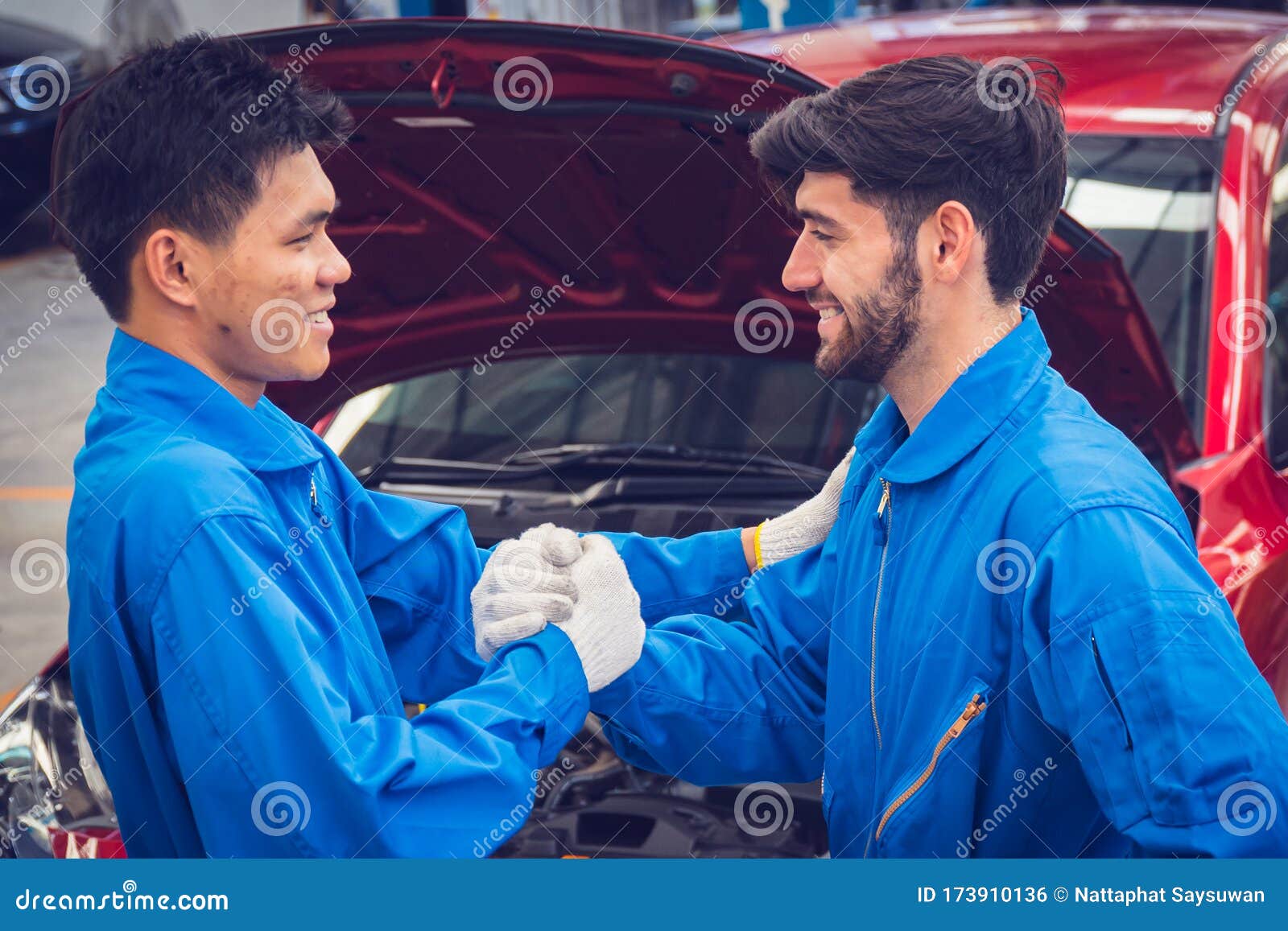 Mechanics Working in the Workshop Garage. Team Work Concepts Stock ...