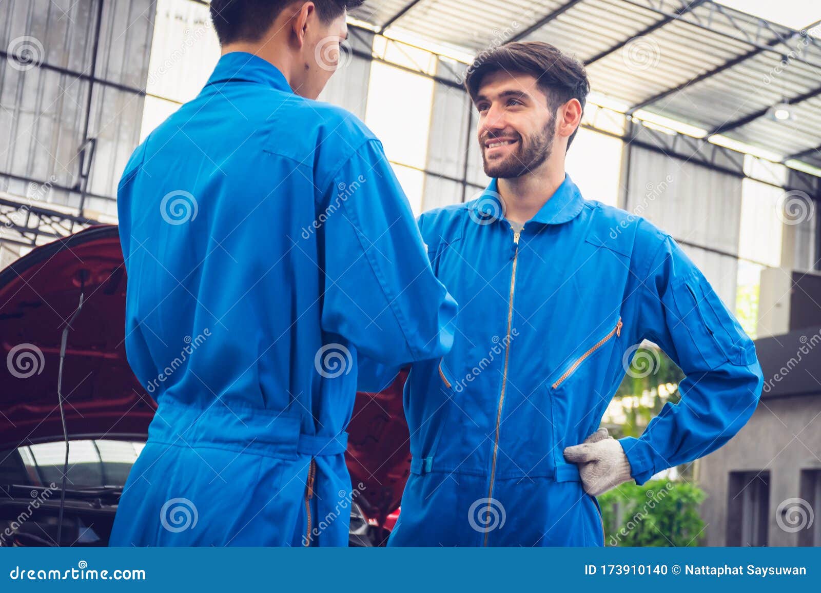 Mechanics Working in the Workshop Garage. Team Work Concepts Stock ...