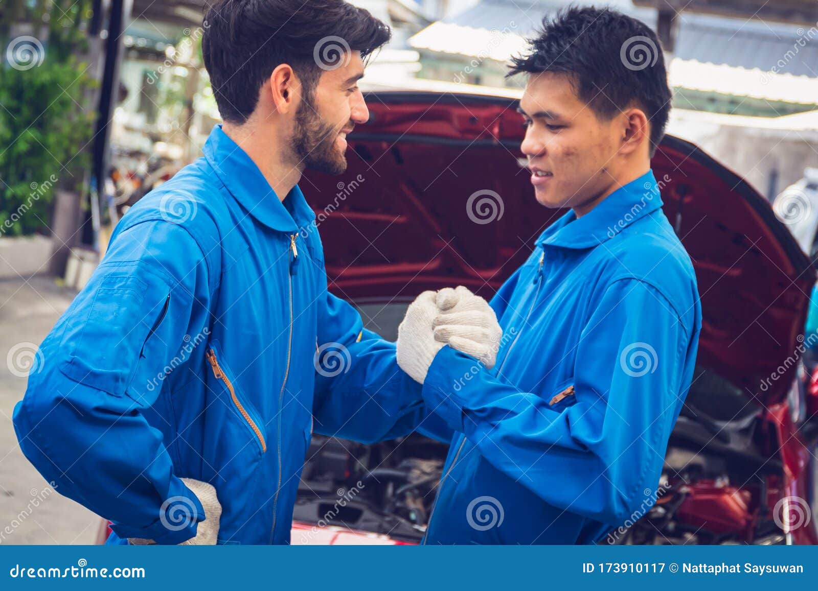 Mechanics Working in the Workshop Garage. Team Work Concepts Stock ...