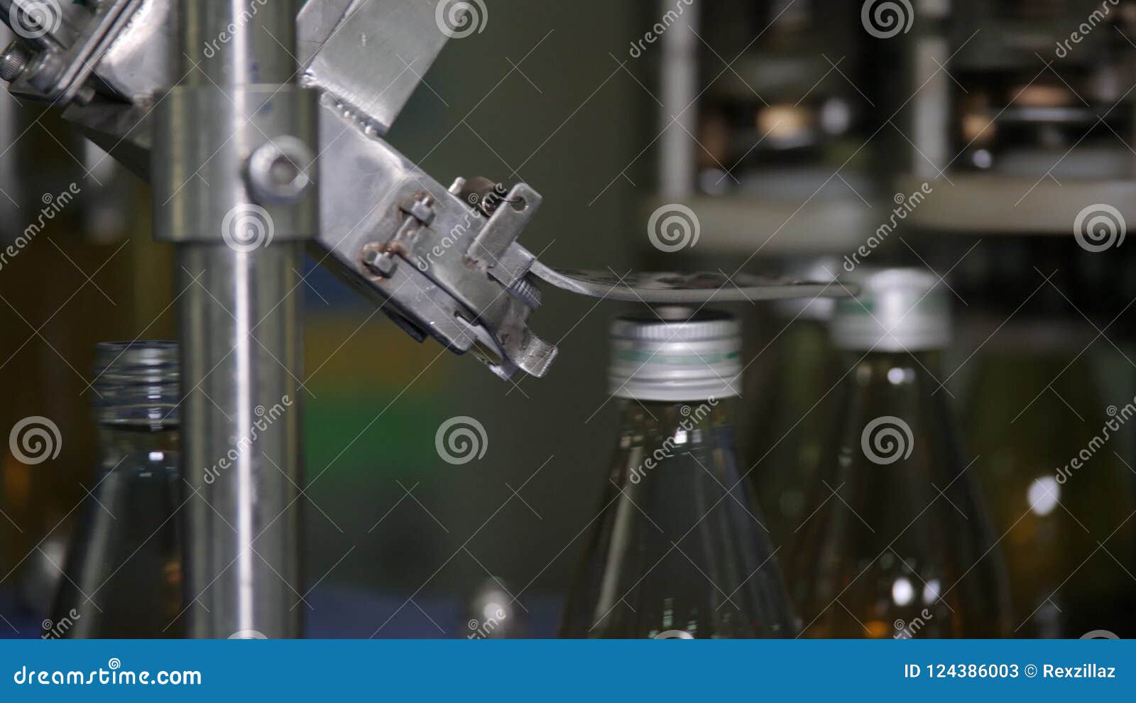 The Mechanism of the Automatic Bottle Capping Machine. Stock Video ...