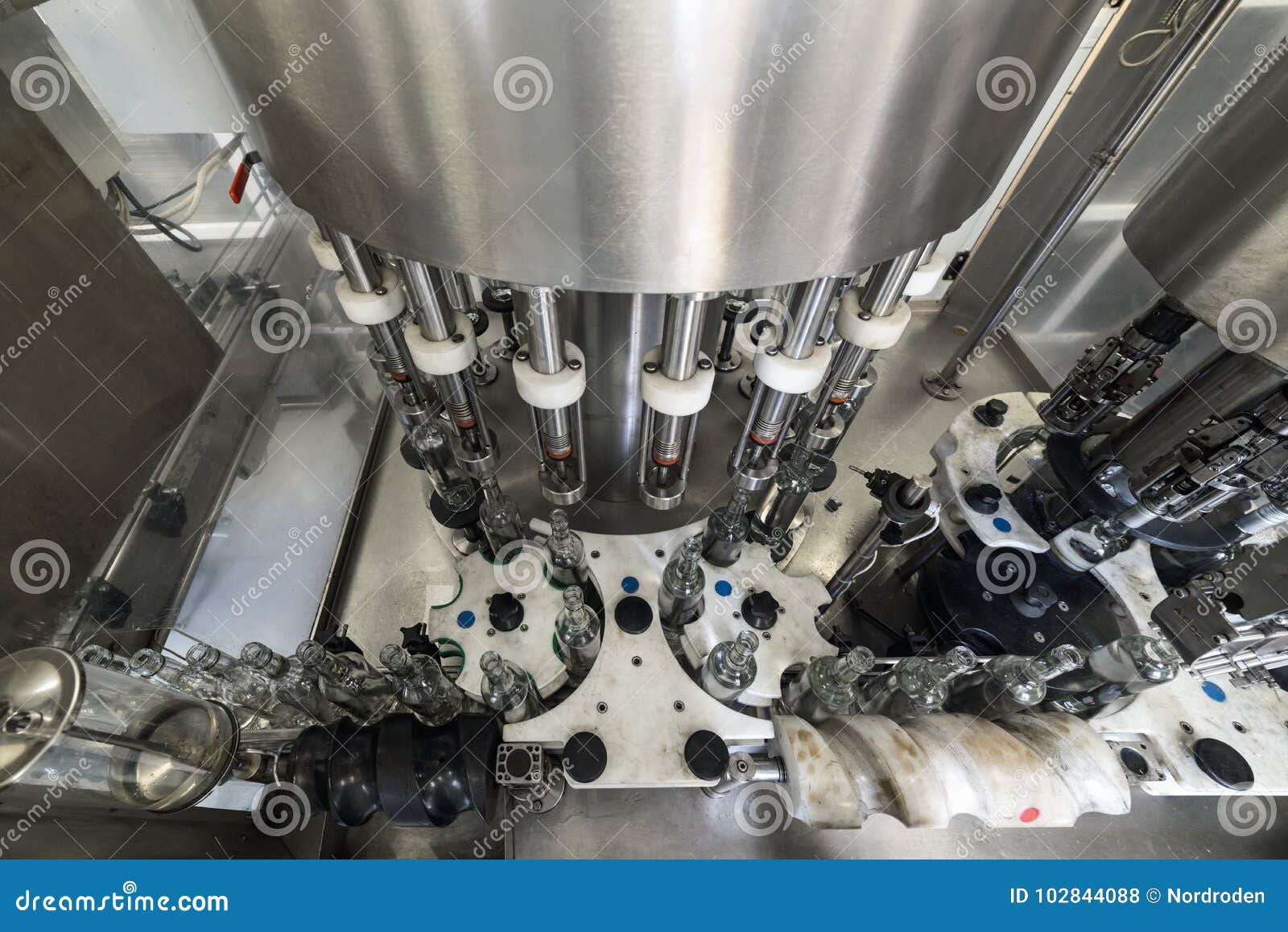 The Mechanism of an Automatic Machine for Filling and Capping Bottles ...