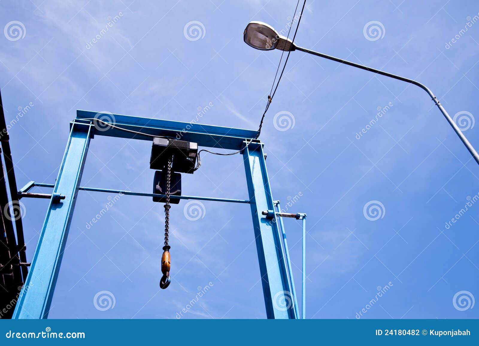 Mechanism Hanging from a Crane Stock Photo - Image of crane, cables ...