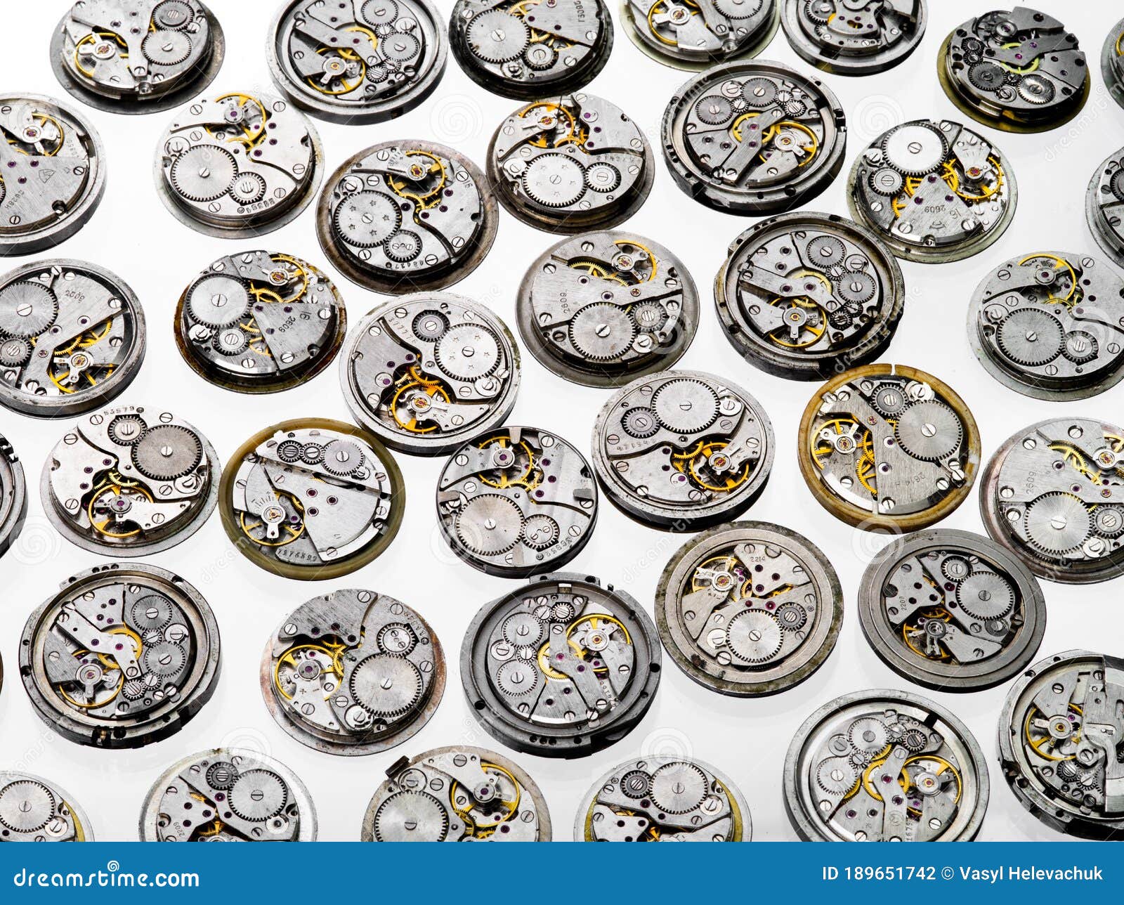 Clock Lying On Dial With Open Clockwork On An Isolated Gray Studio ...