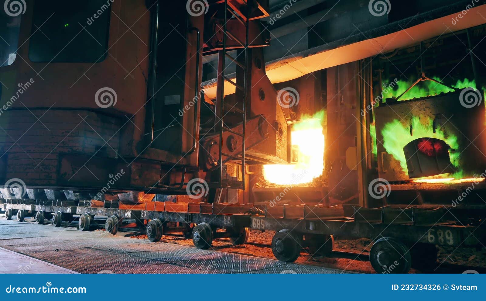 Mechanized Loader is Submerging Copper into a Smelting Chamber Stock ...