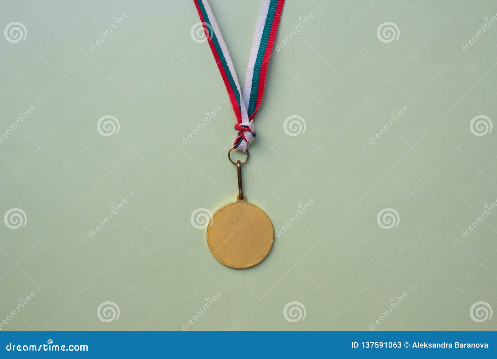 Gold Medal on a Multicolored Ribbon on a Green Background Stock Image ...