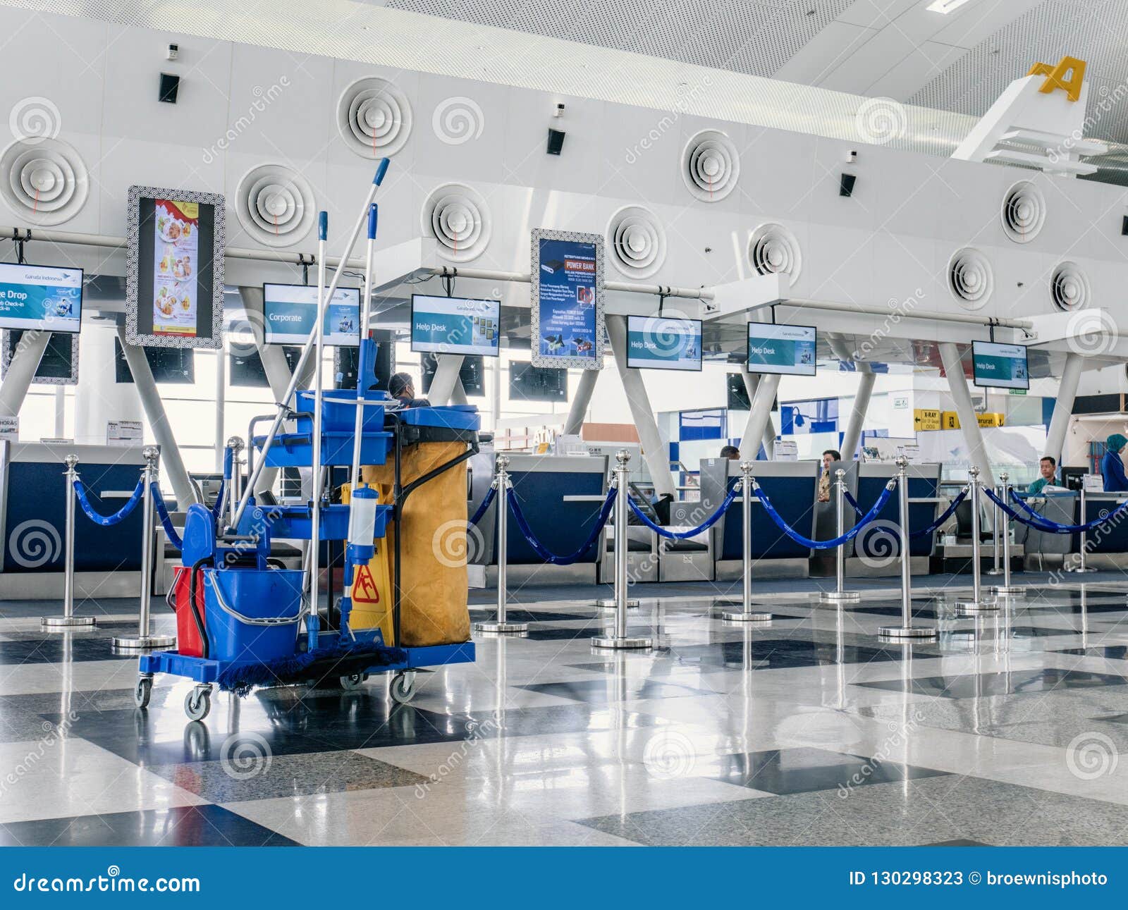 Man Cleaning Check-In Counter Airport With Multifunction Cleaning Cart ...