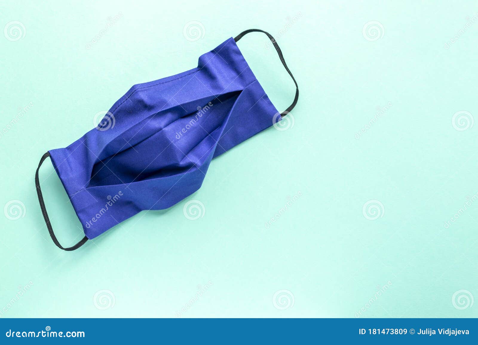 Medecine. Dark Blue Reusable Mask on a Mint Plain Background Stock ...