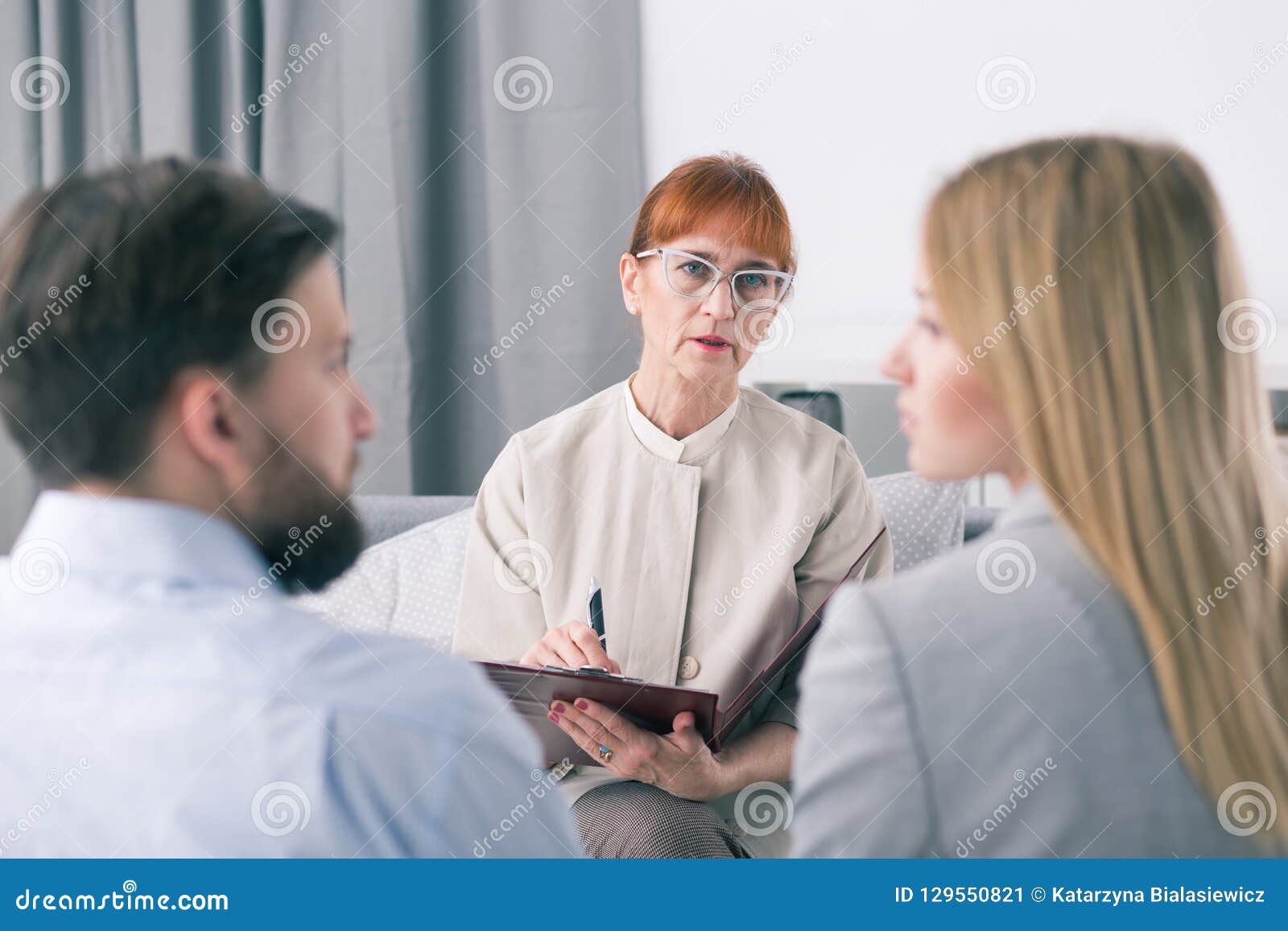 Mediator Talking To a Couple during a Session Stock Image - Image of ...