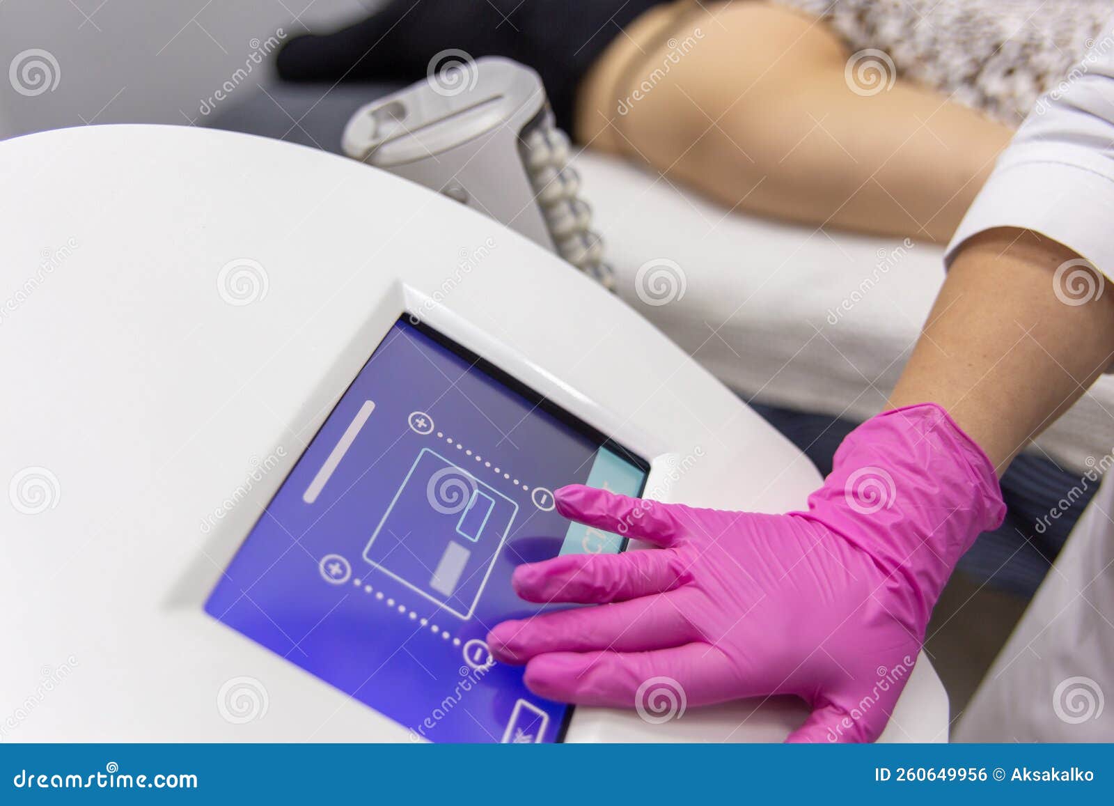A Medic Adjusts the Operating Mode of the Anti-cellulite Massage ...