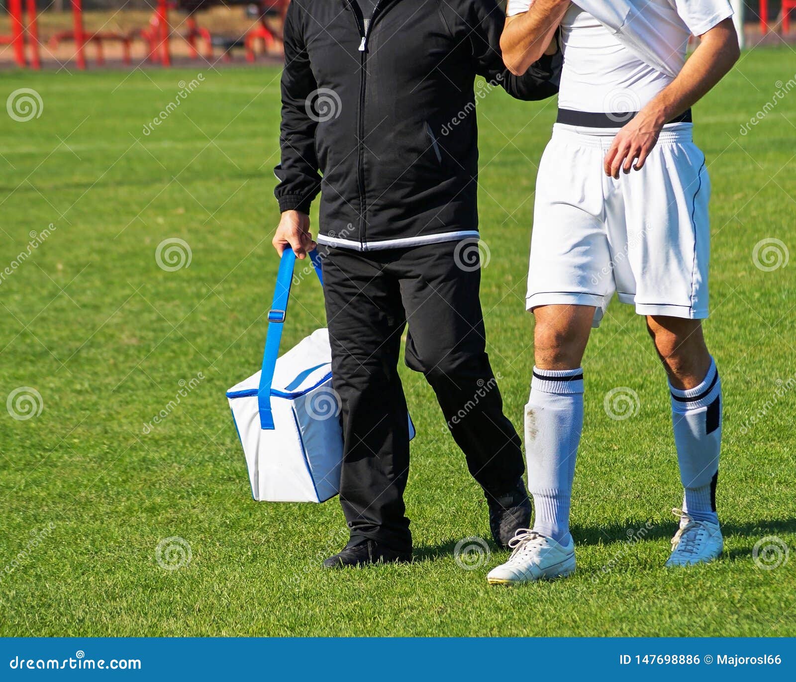 Medic Helps the Injured Soccer Player Stock Photo - Image of white ...