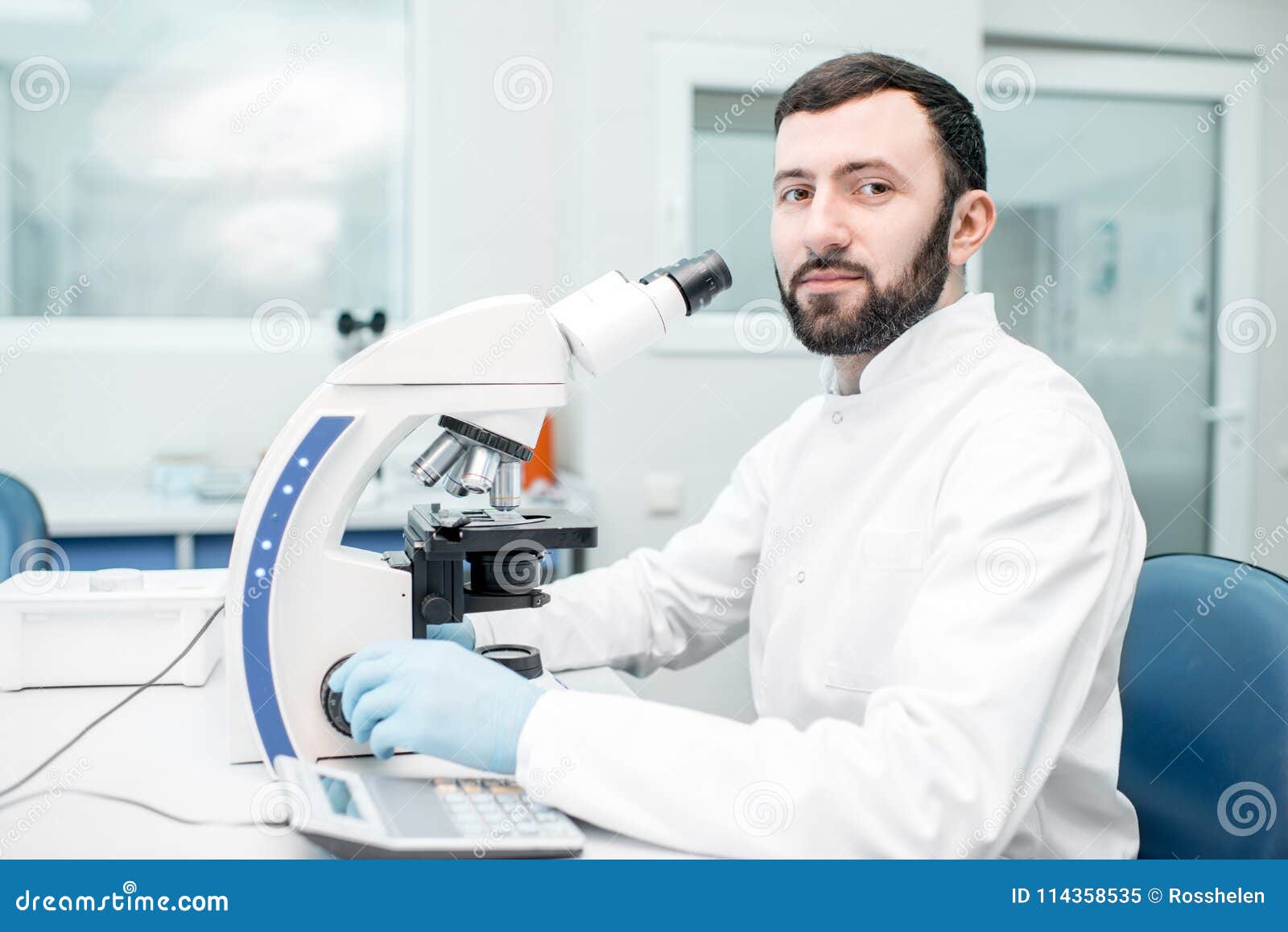 Medic Working with Microscope at the Laboratory Stock Image - Image of ...