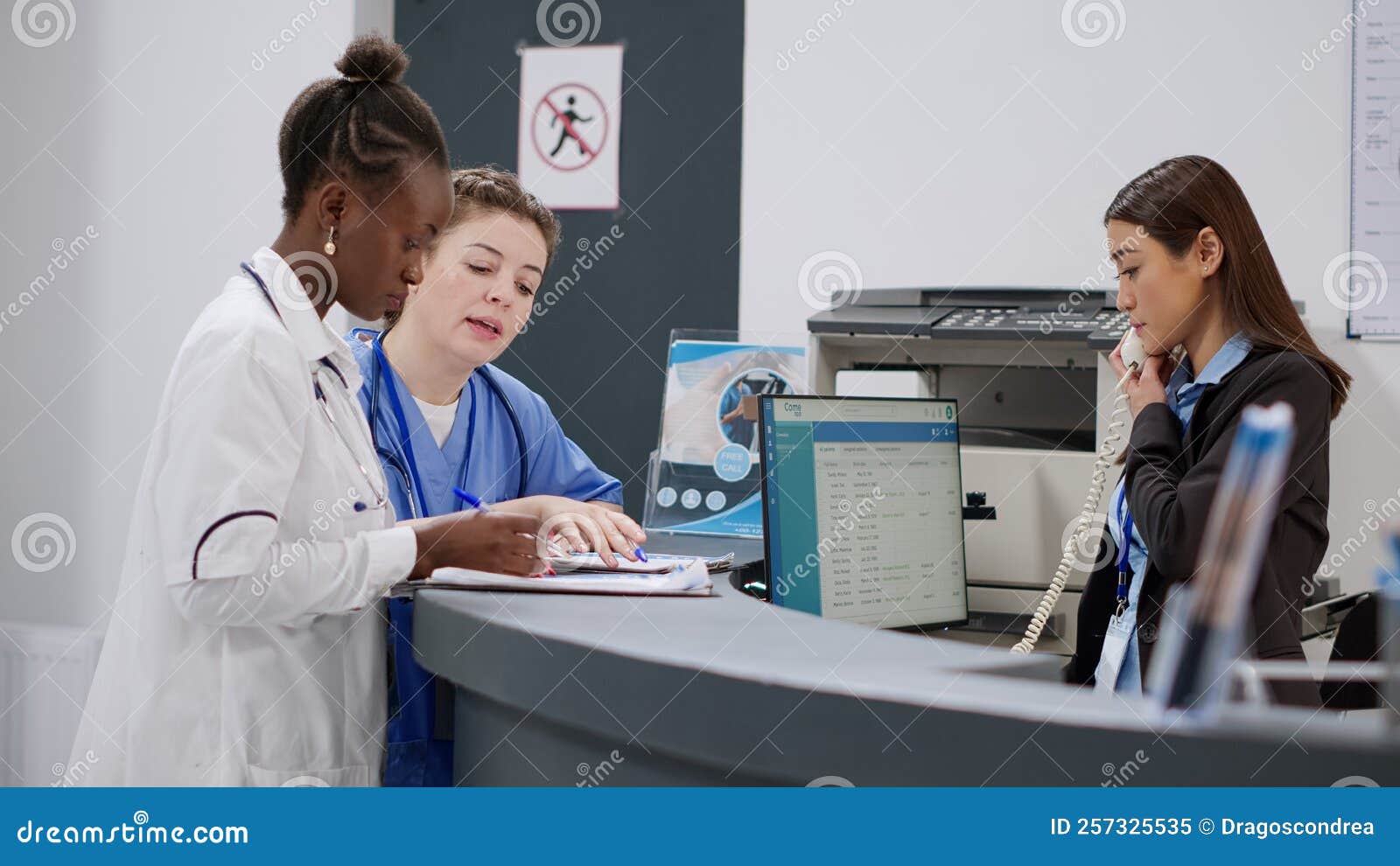 Medical Assistant and Doctor Analyzing Report Papers at Reception ...