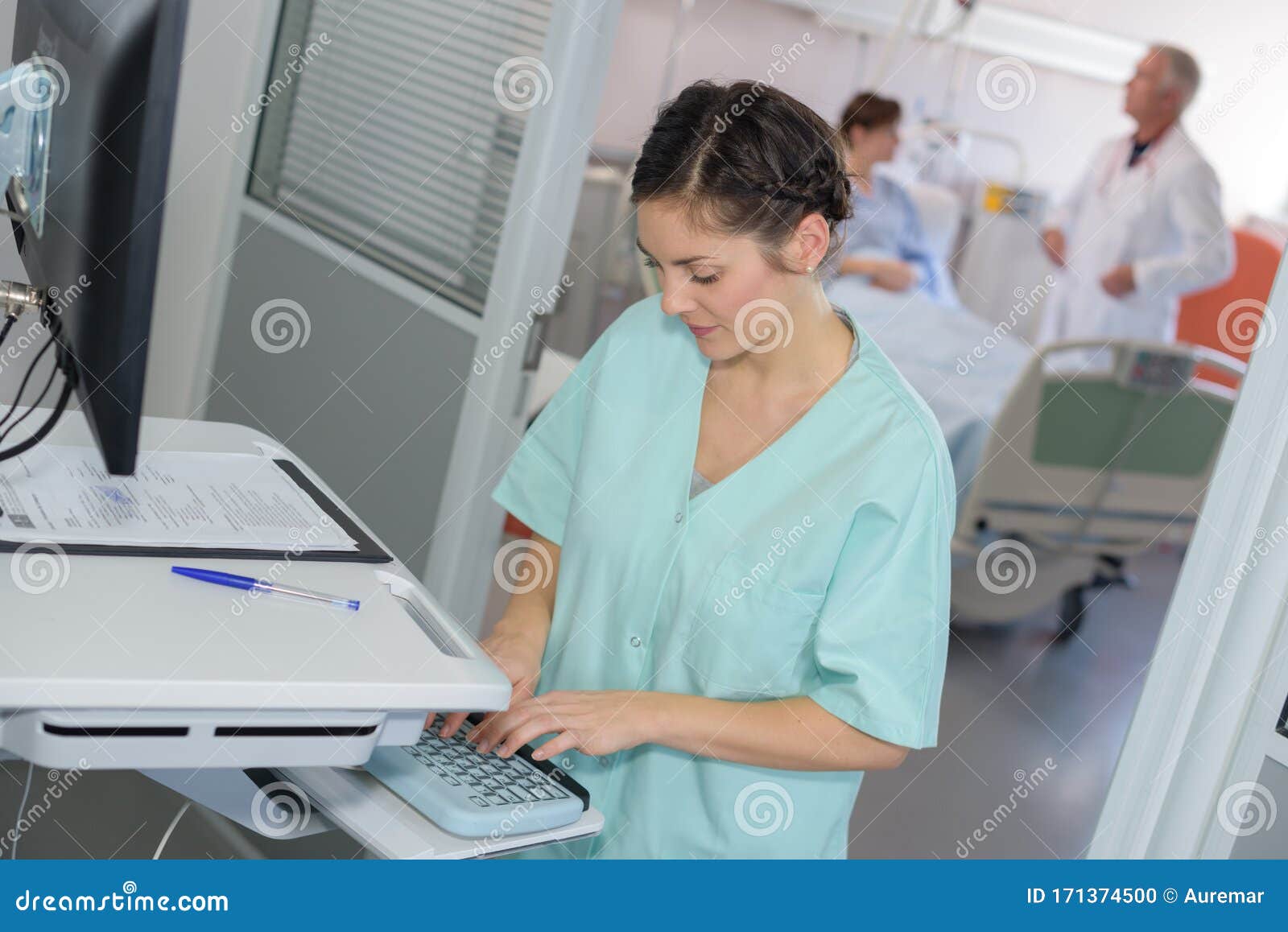 Medical assistant typing stock photo. Image of health - 171374500