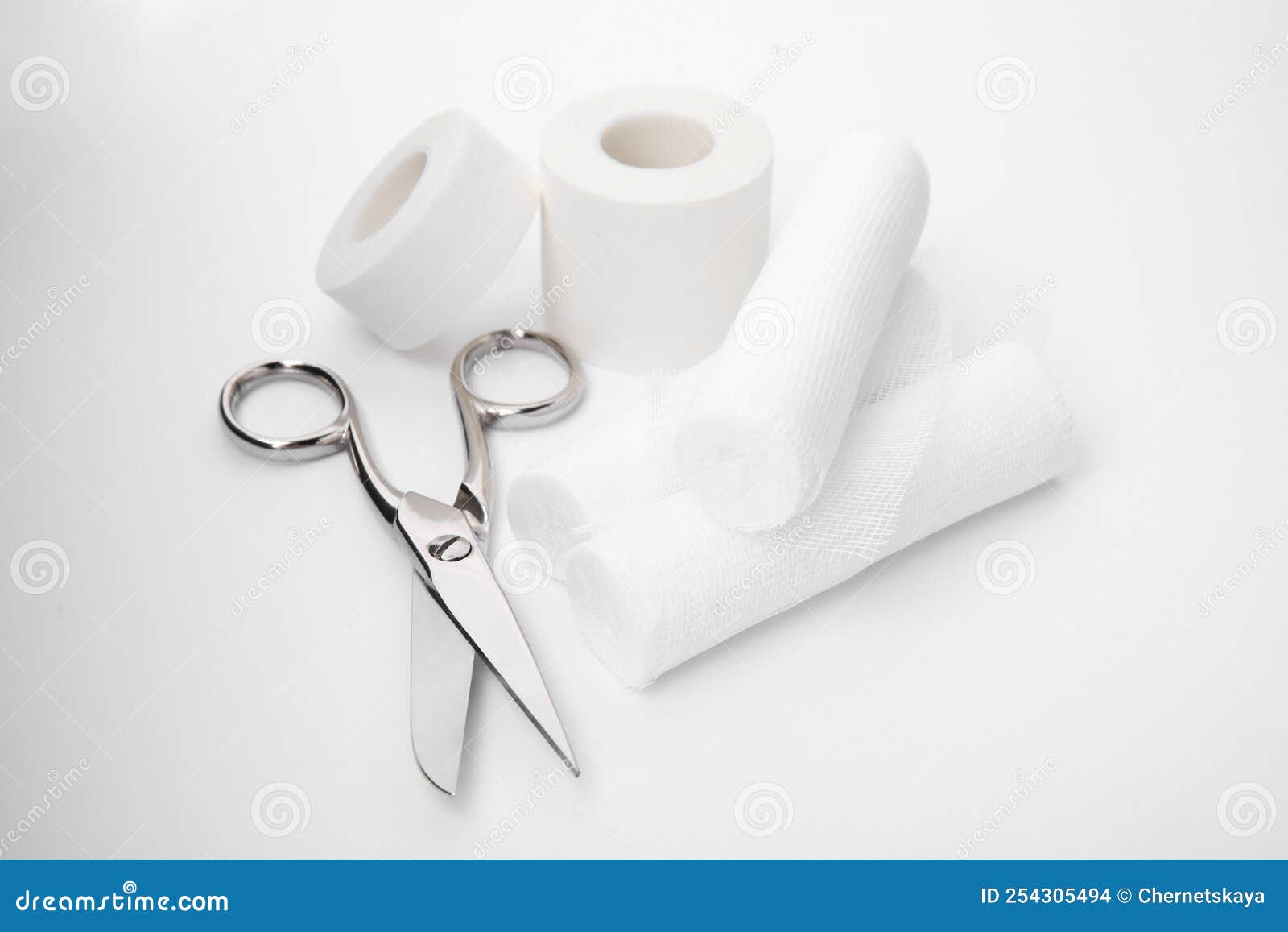 Medical Bandage Rolls, Sticking Plaster and Scissors on White ...