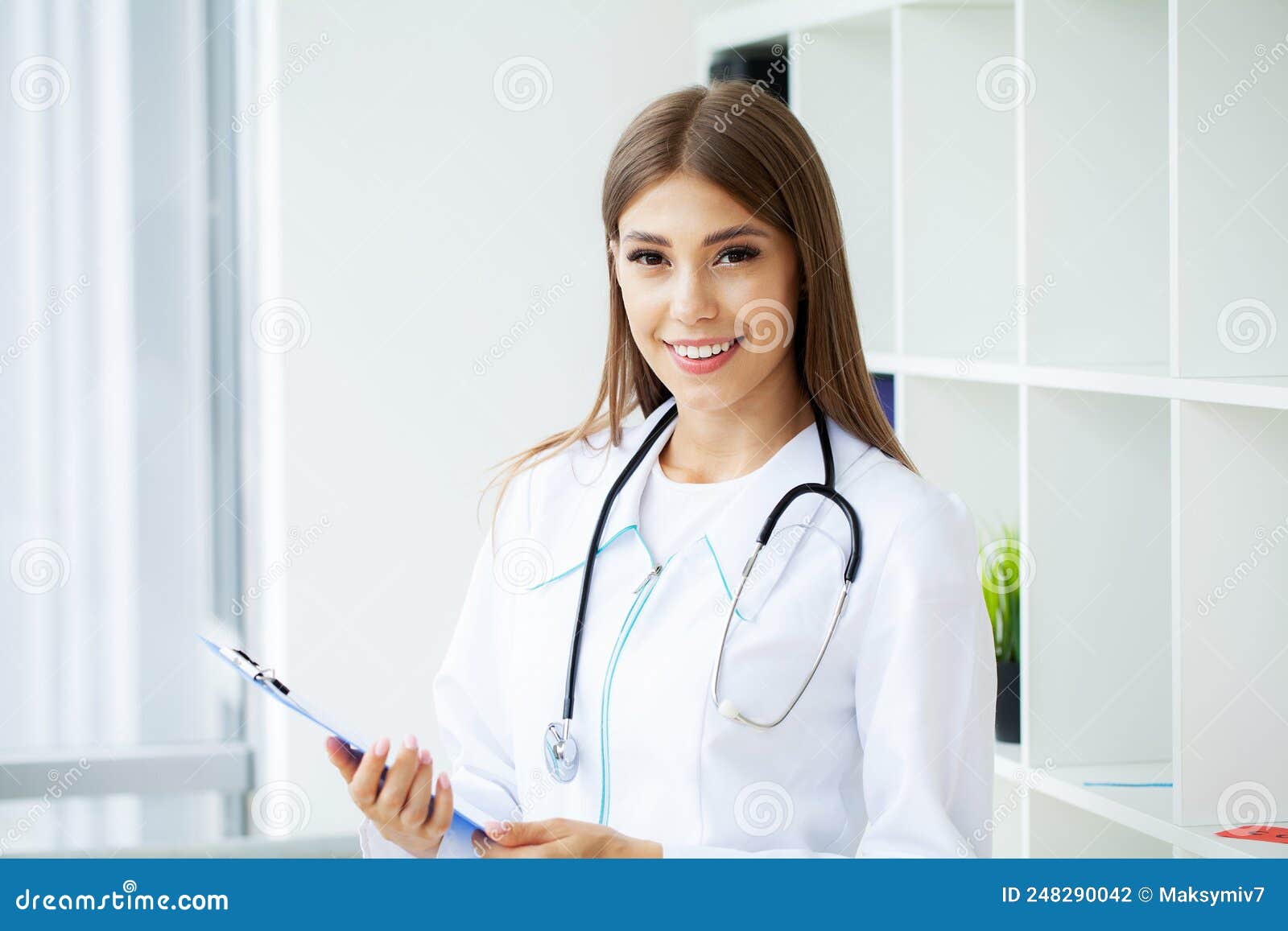 Medical Beautiful Female Doctor In White Coat With Stethoscope Stock