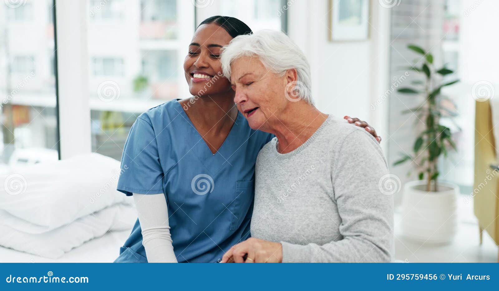 Medical Black Woman Nurse Hugging A Senior Patient With A Disability