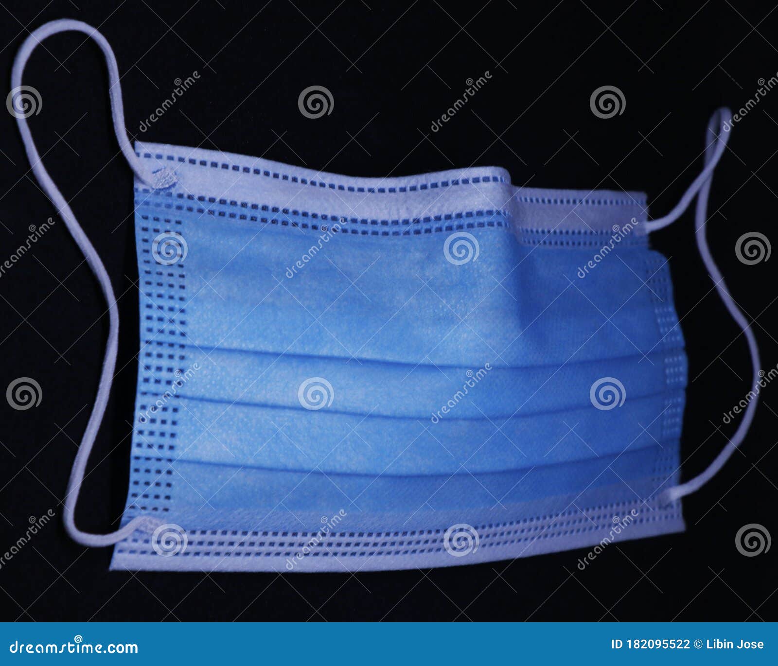 Medical Blue Face Mask Isolated with Black Background Stock Photo ...