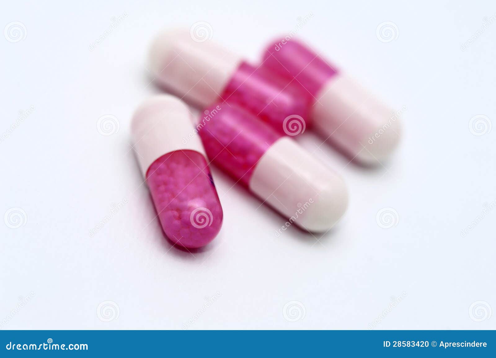 Medical Capsules With Colored Granules In A Row On A White Background ...