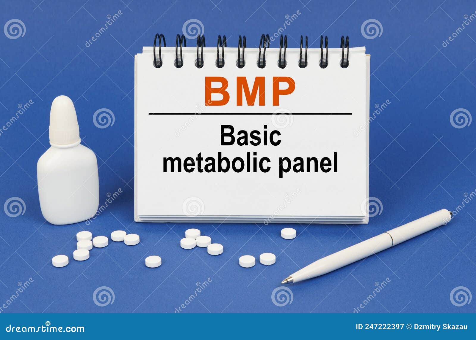 On a Blue Background, a Pen, Tablets and a Notepad with the Inscription ...