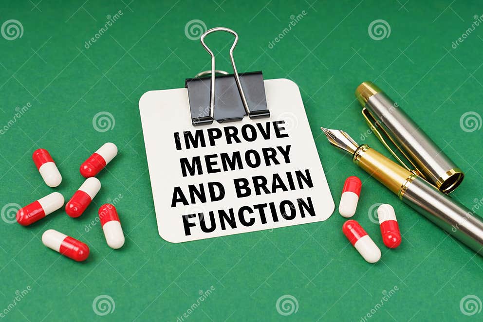 On the Green Surface of the Tablet, a Pen and a Notepad with the ...