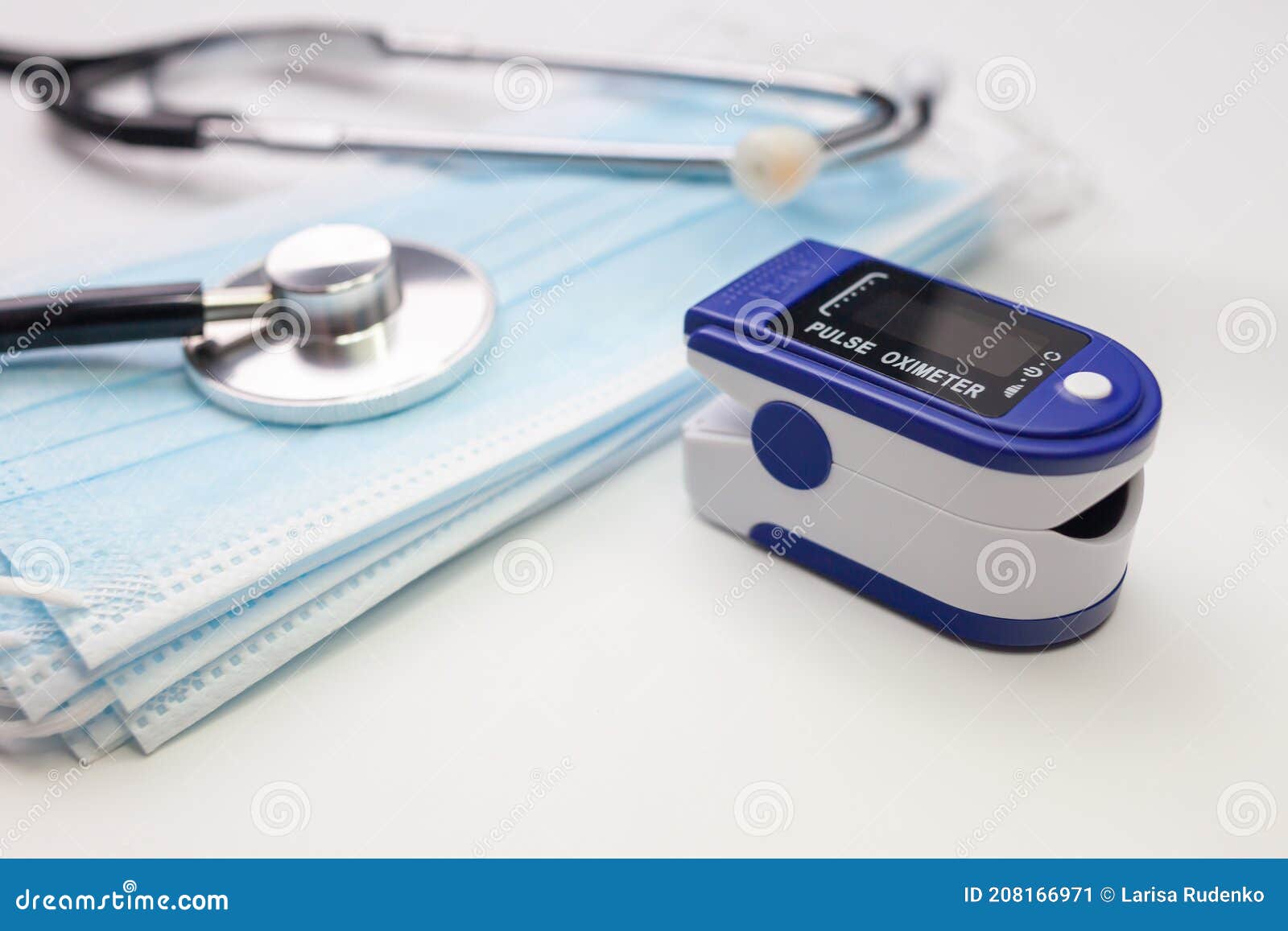 Medical Concept. Pulse Oximeter, Stethoscope and Face Masks Stock Image ...