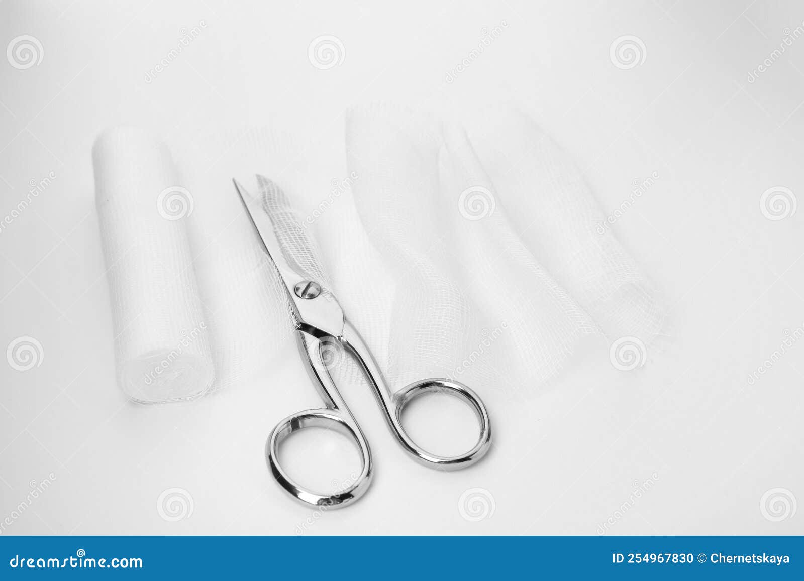 Medical Cotton Bandage and Scissors on White Background Stock Photo ...