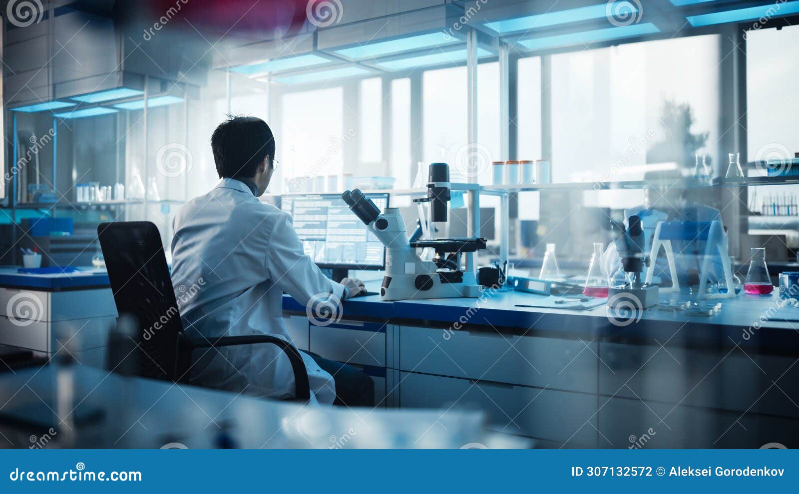 Medical Development Laboratory: Back View of Japanese Male Scientist ...