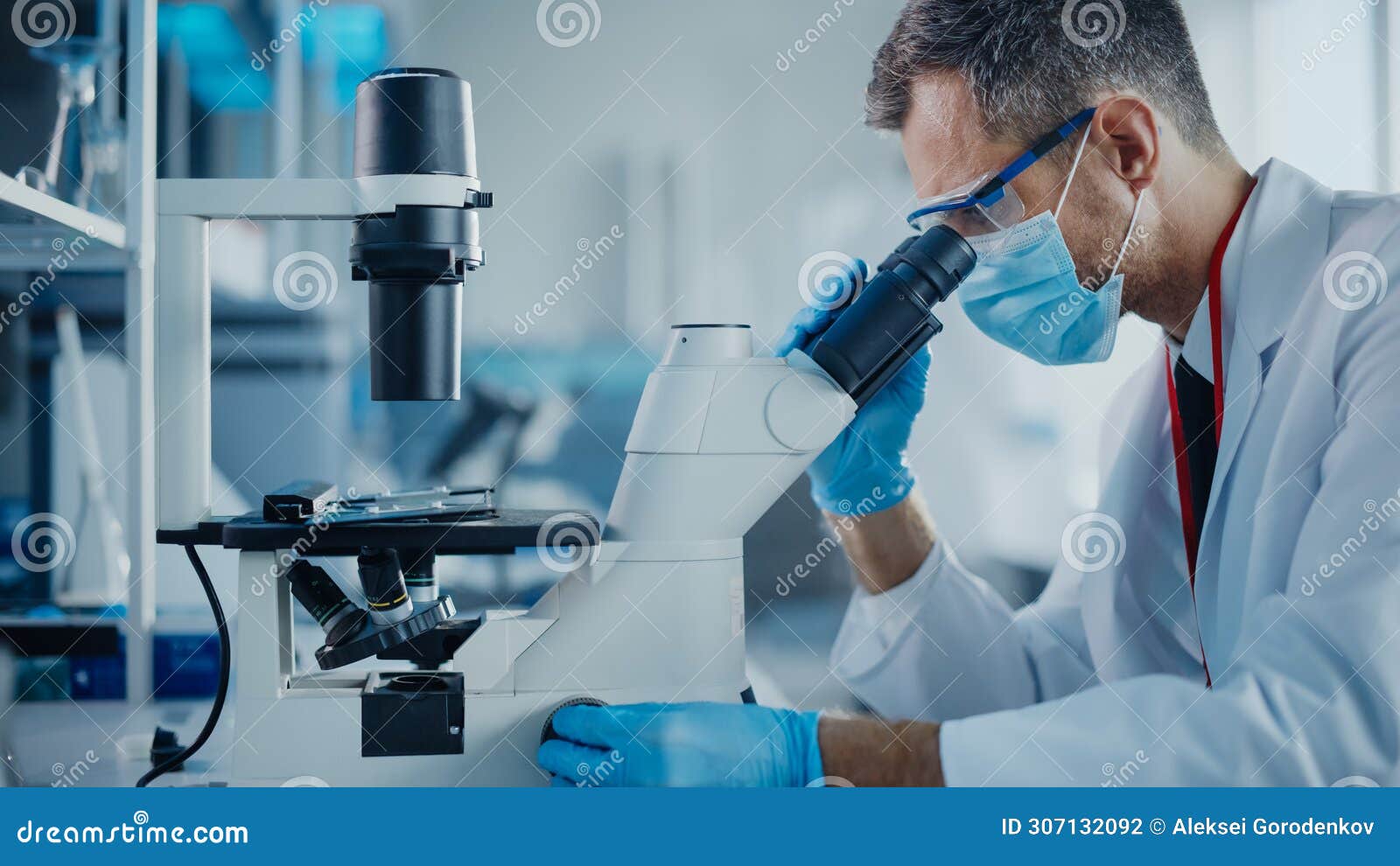 Medical Development Laboratory: Scientist Wearing Face Mask Looking ...