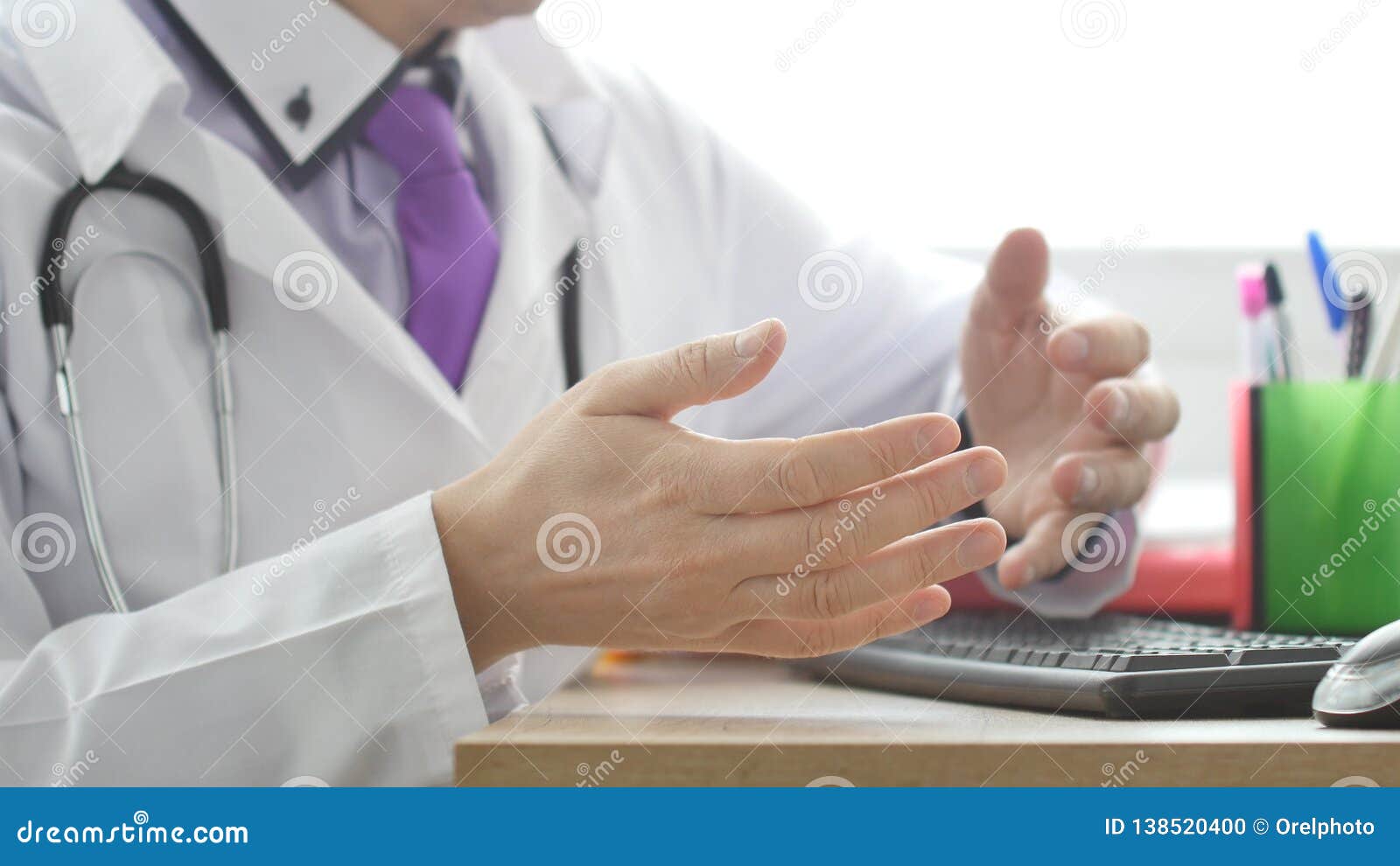 A Doctor Explaining Something by Making Hands Gestures Stock Photo ...