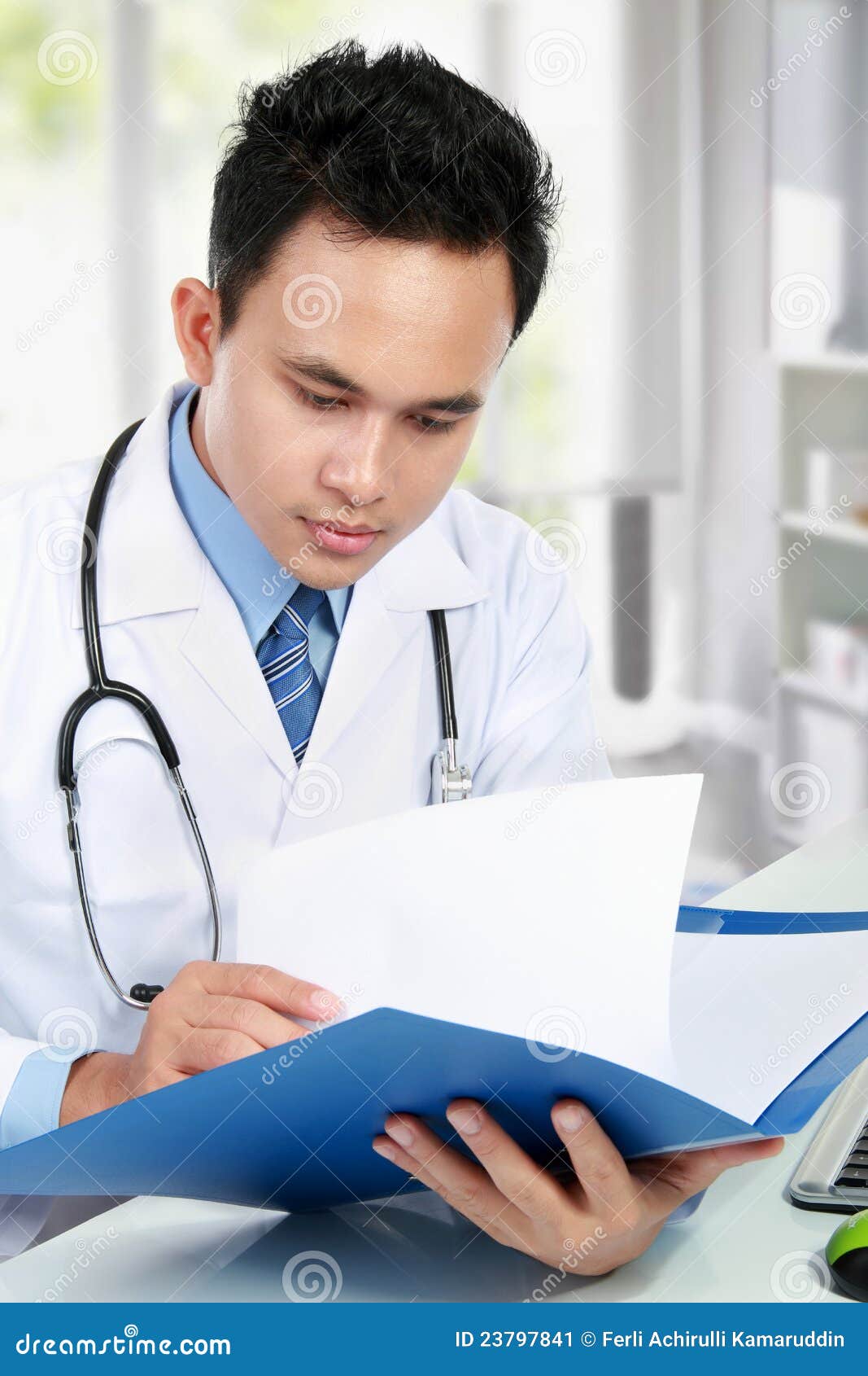 Medical Doctor Reading a Report Stock Image - Image of adult, folder ...