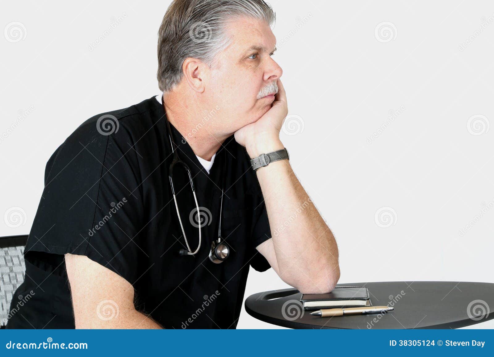 Medical Doctor Wearing Scrubs Bored Writing Script Stock Photo - Image ...