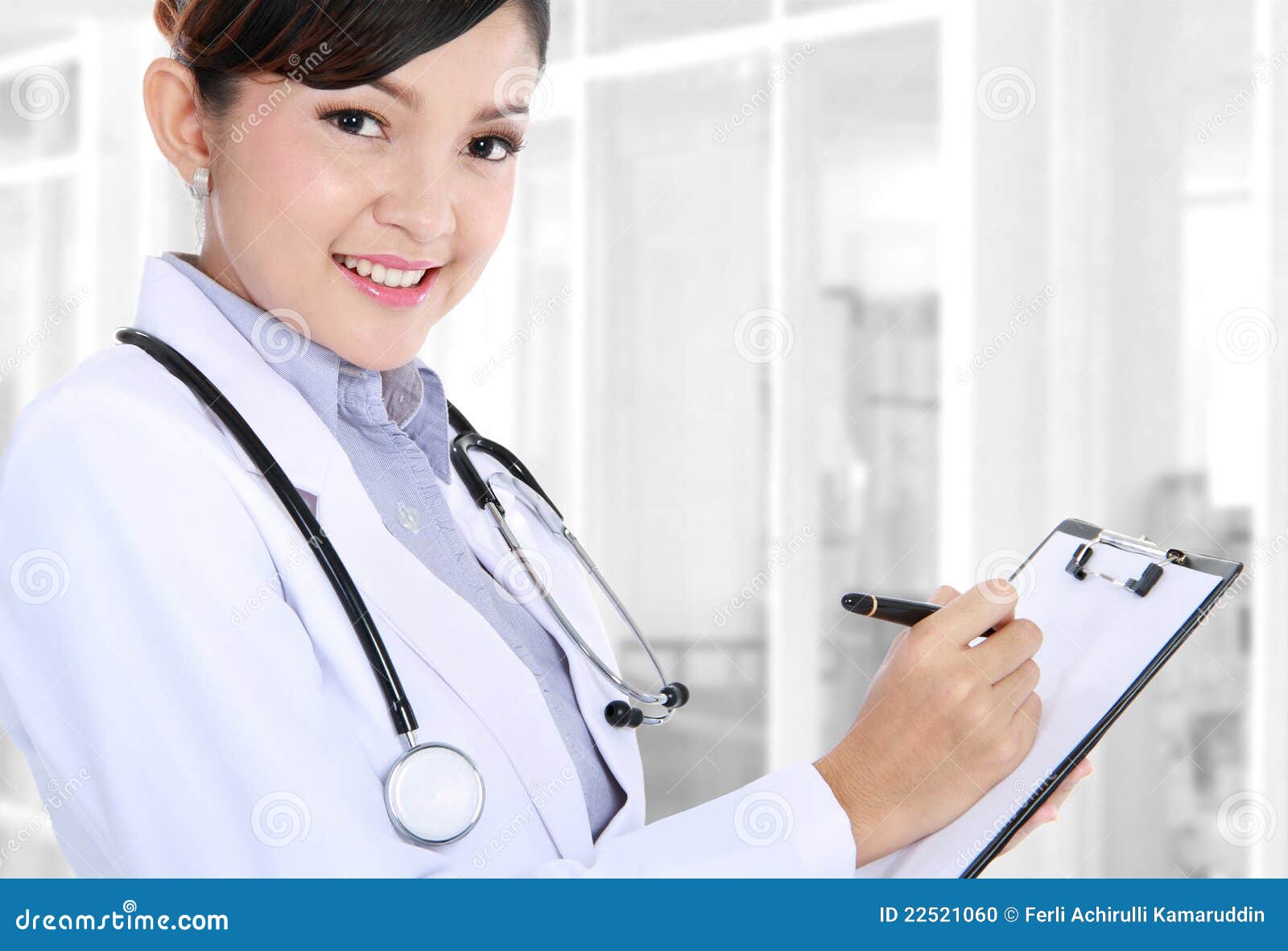 Medical Doctor Writing on Clipboard Stock Photo - Image of confident ...