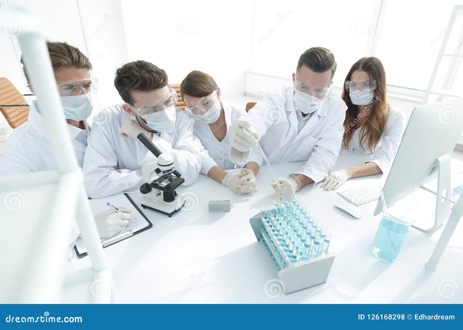 Medical Doctors are Working with Test Tubes and Microscope at the Lab ...